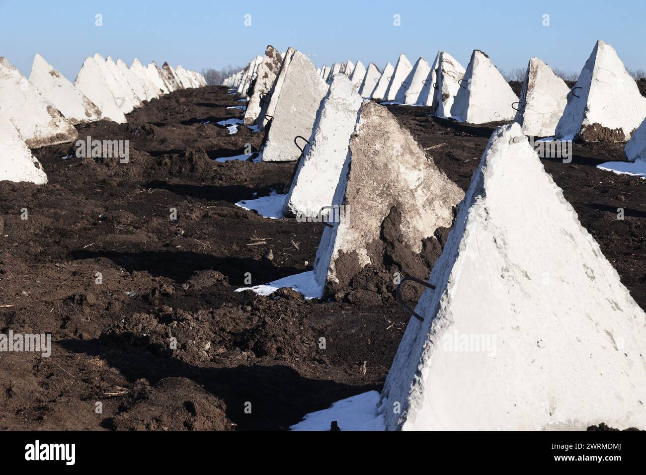 KHARKIV REGION, UKRAINE - MARCH 12, 2024 - Concrete anti-tank ...
