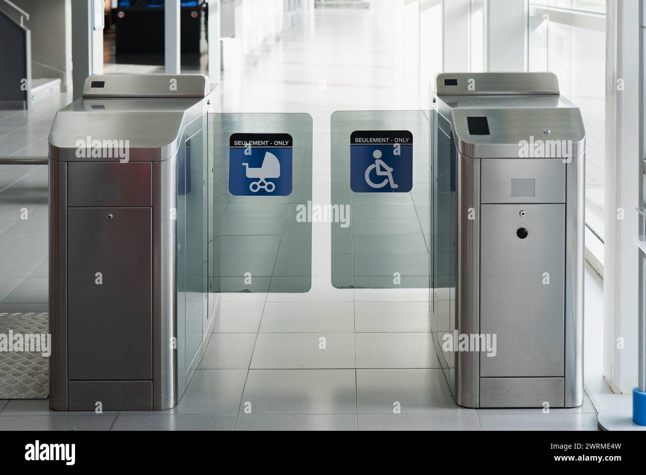 An image showcasing modern entry turnstiles with ticket readers at a ...