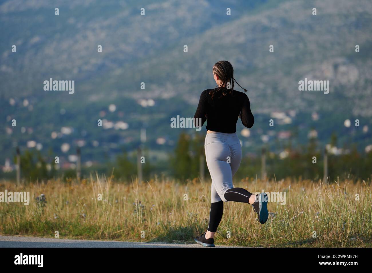 Solo Stride: Determined Athlete Woman Embarks on Fitness Journey for ...