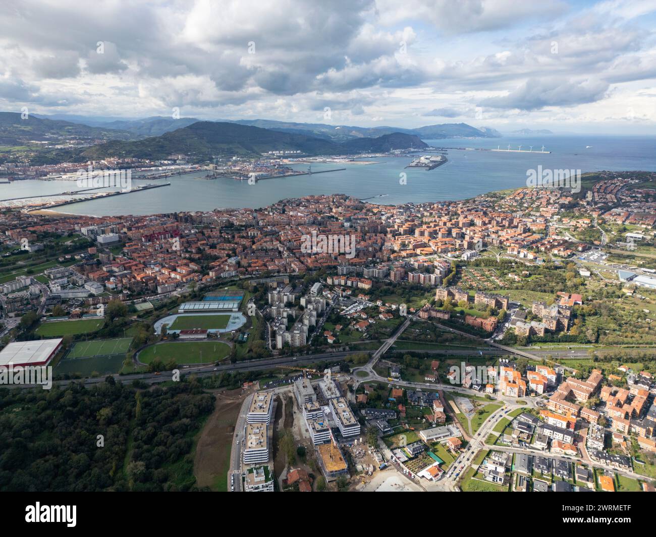 A drone captures the sprawling cityscape featuring modern buildings ...