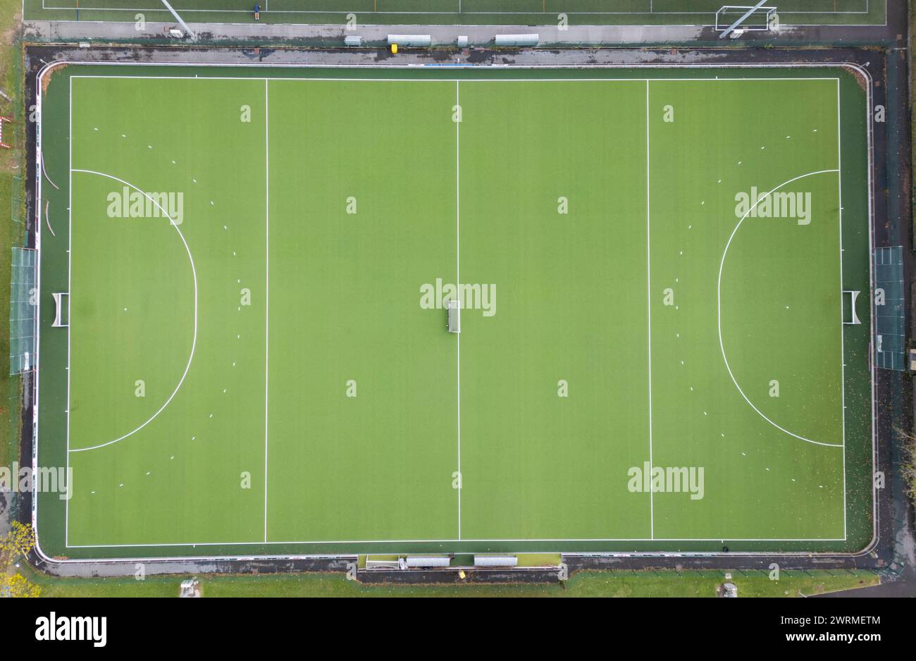 Aerial view of empty green soccer fields with white markings, captured ...