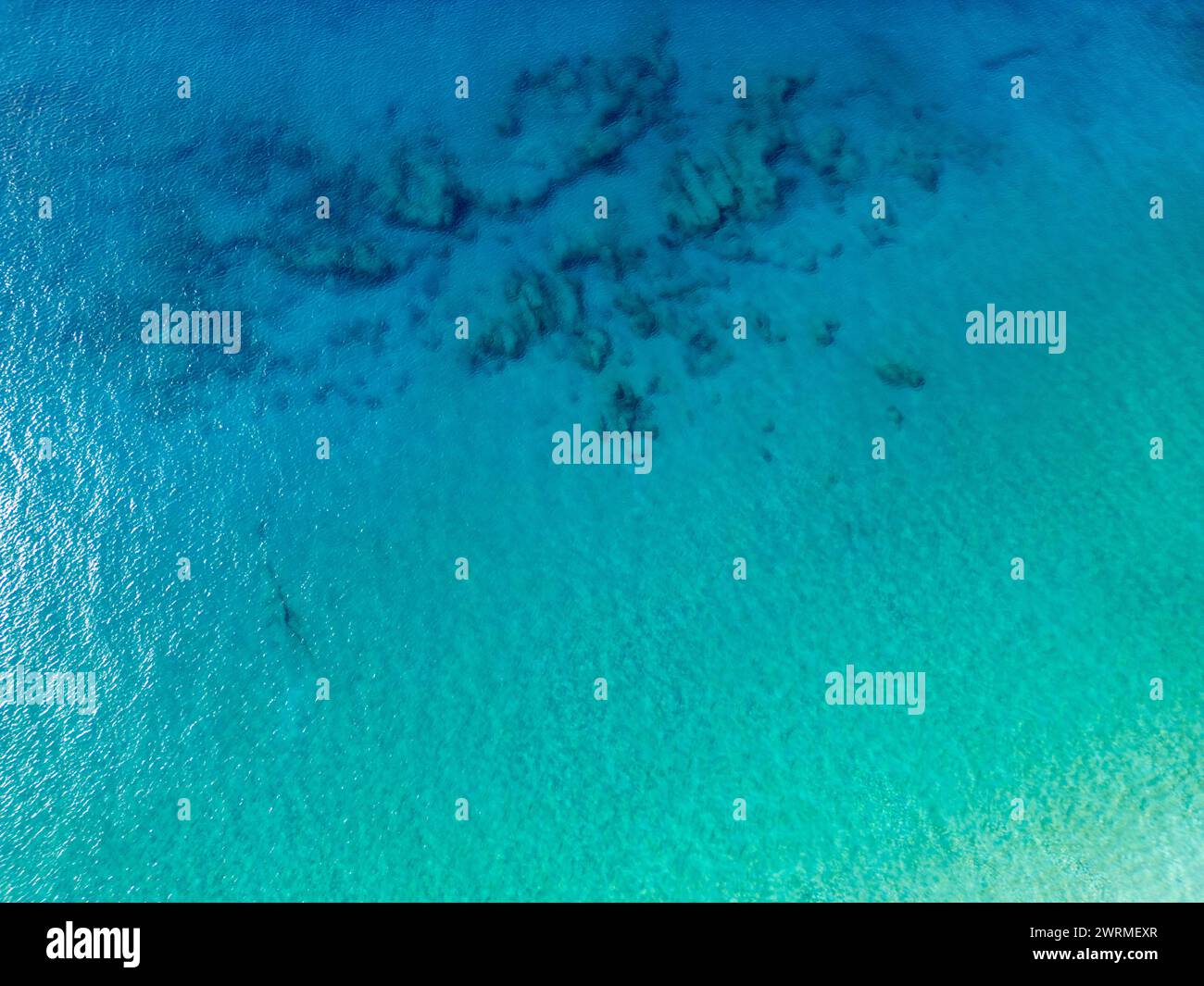 An aerial image showcasing the stunning textures of a shallow ocean ...