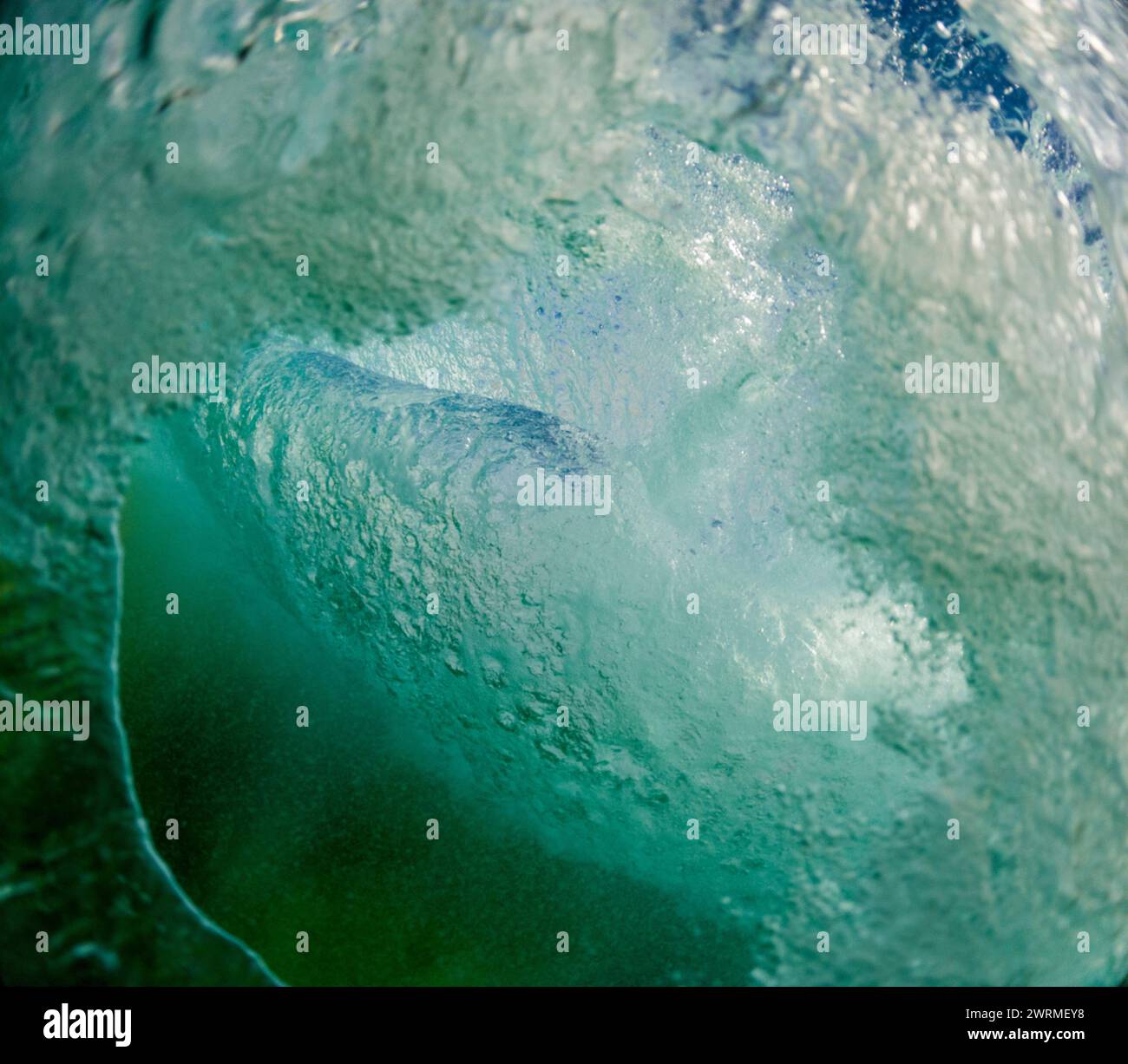 An immersive perspective inside a wave barrel, showcasing the intricate ...