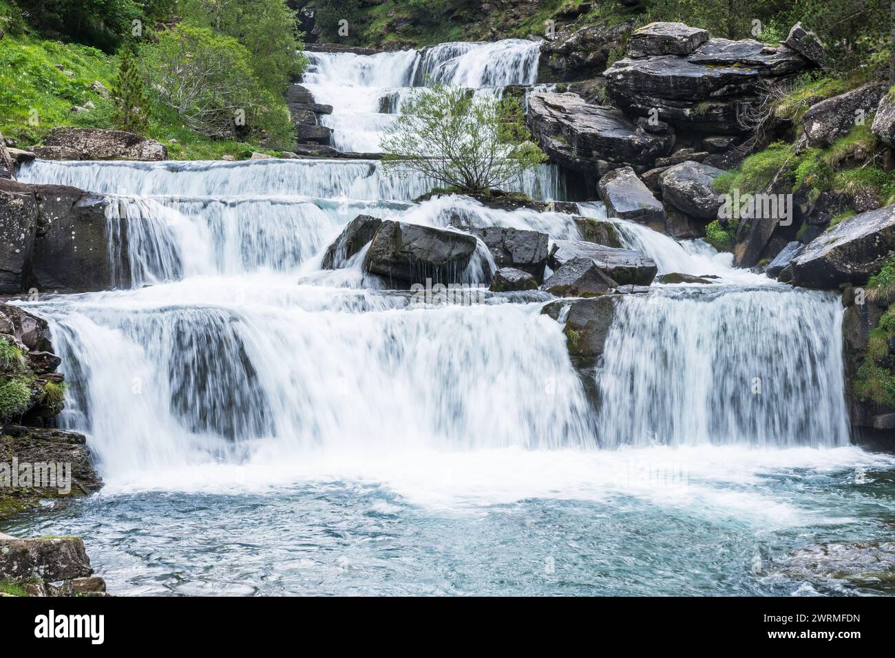 Captivating multi-level waterfalls cascade over rocky ledges in the ...