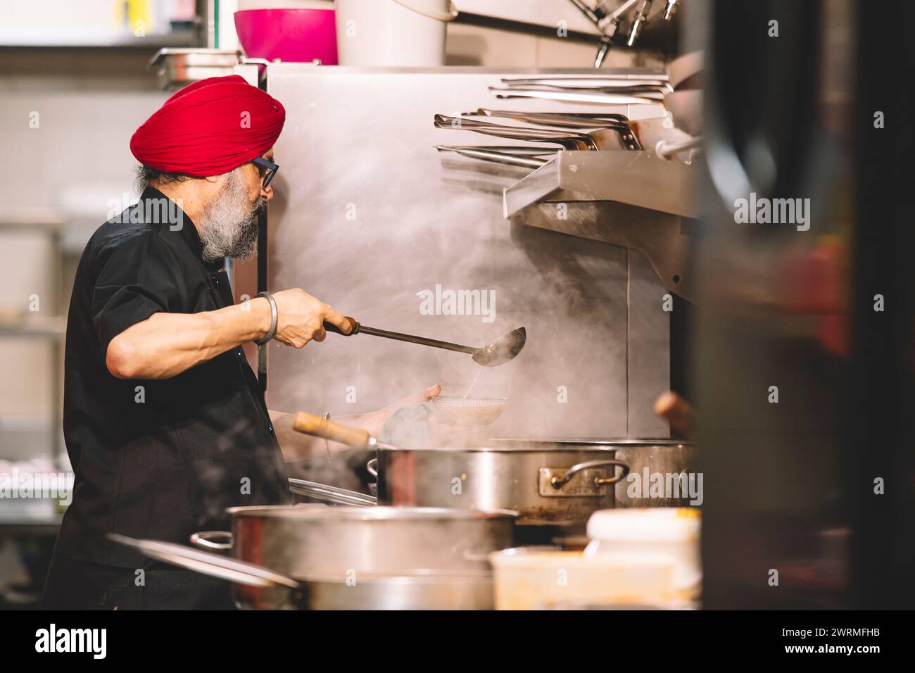 Stirring large pot hi-res stock photography and images - Alamy