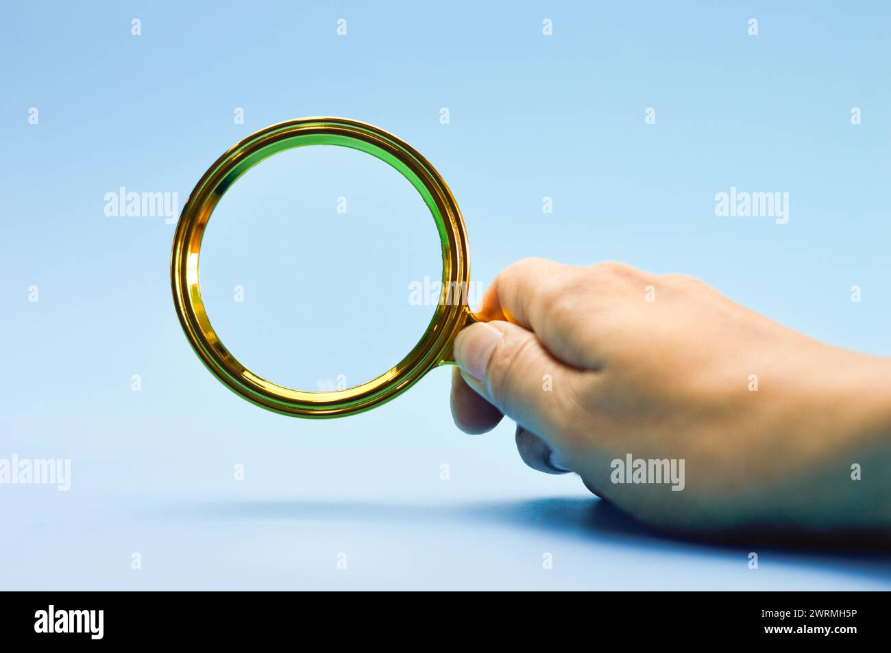 Mature man magnifying glass examining hi-res stock photography and ...