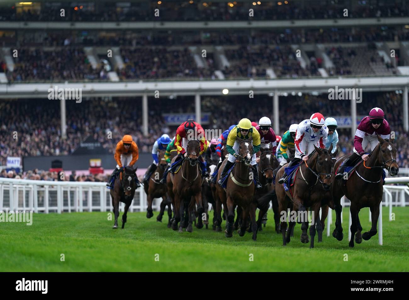 Runners and riders in action during the Coral Cup Hurdle on day two of ...