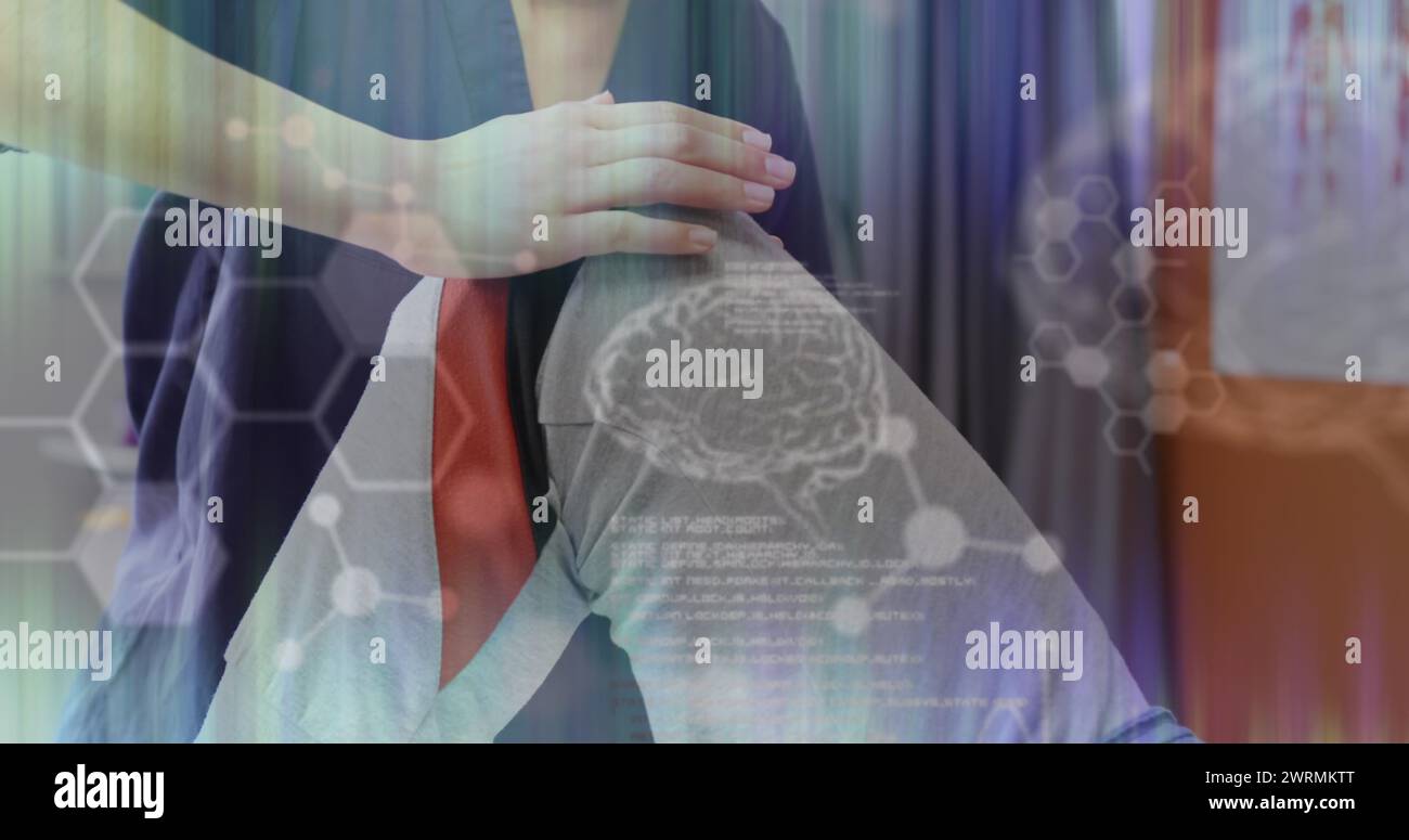 Image of brain and medical data over biracial female therapist working ...