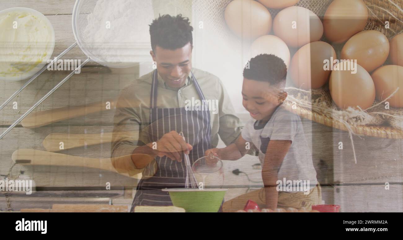 Image of happy african american father and son baking over eggs and ...