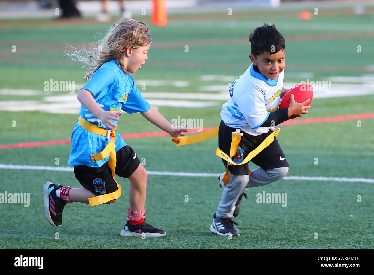 Youth Football players participate during the Snoop & House Flag ...