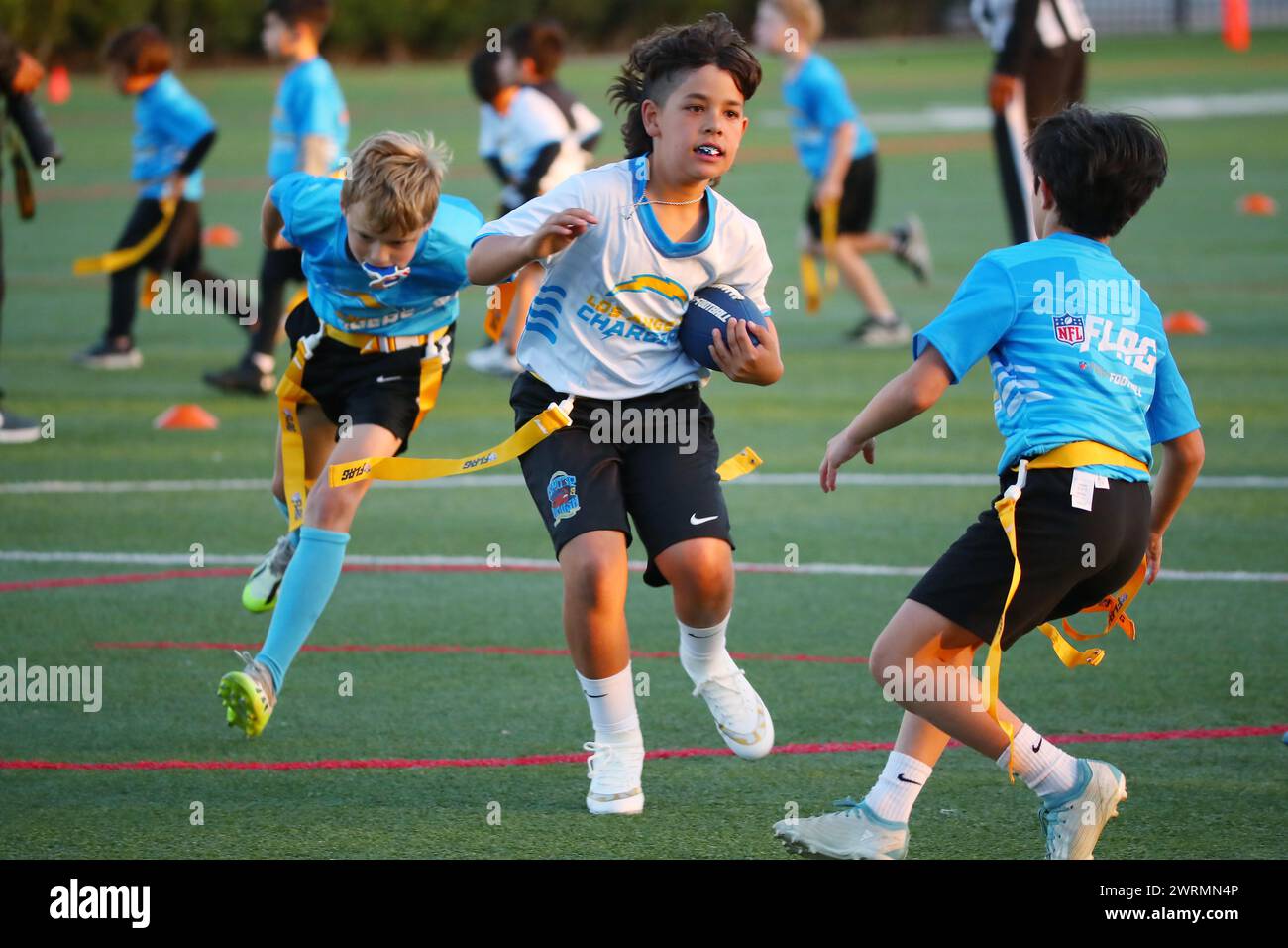 Youth Football players participate during the Snoop & House Flag ...