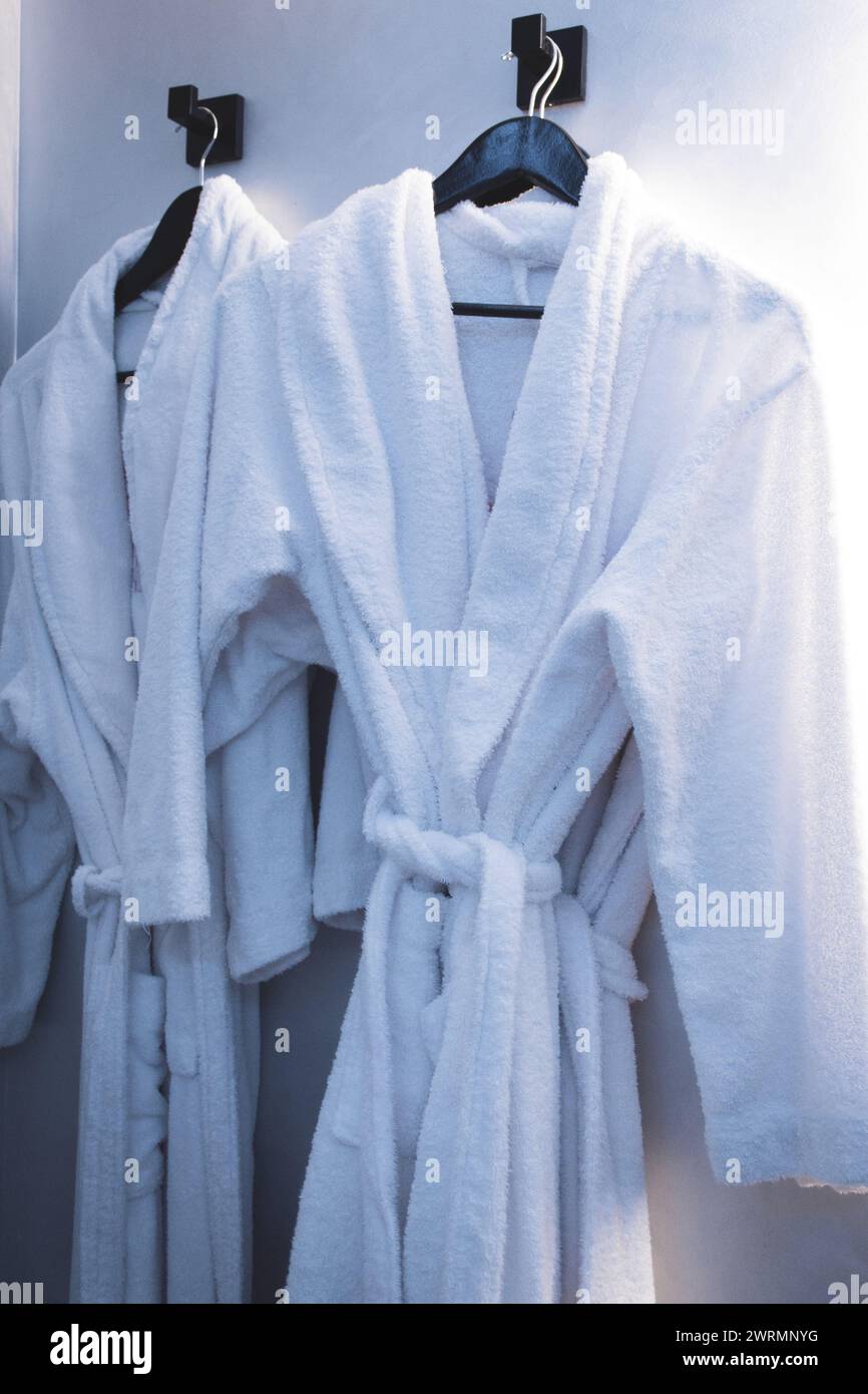 Two White Bathrobes On Hangers Spa Salon Interior Cotton Bathrobes In