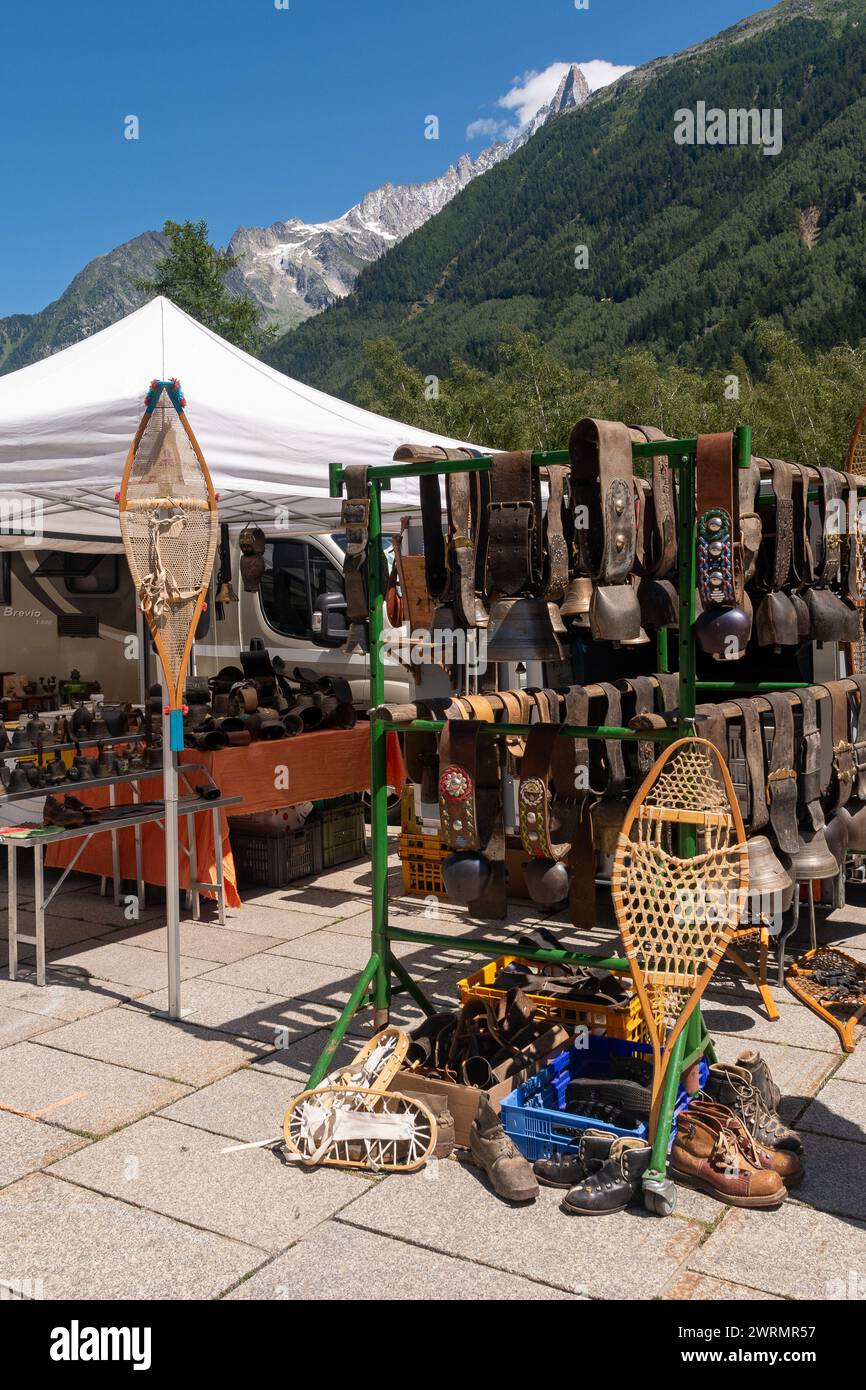 Old ski equipment and cowbells for sale at the street market with the ...