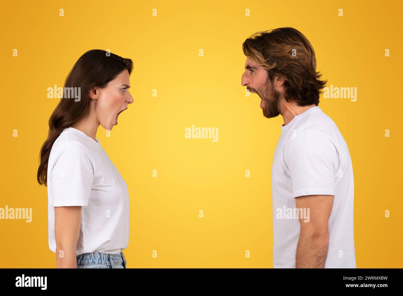 Angry confrontation between a man and woman, both with clenched teeth ...