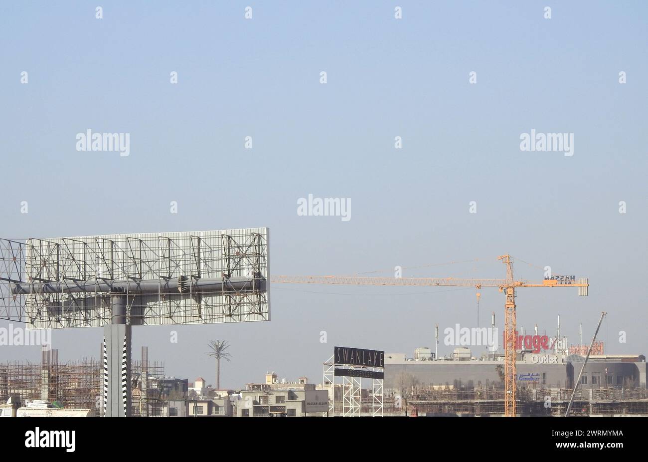 Cairo, Egypt, March 2 2024: A crane tower of Hassan Allam Co, A construction site of new high ...