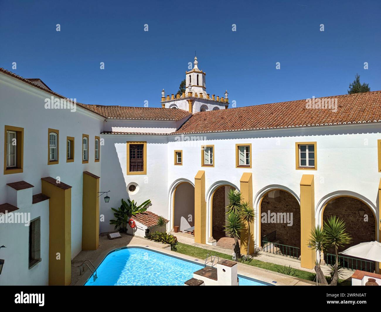 pool at colonial historic european building (hotel convent) with arches ...