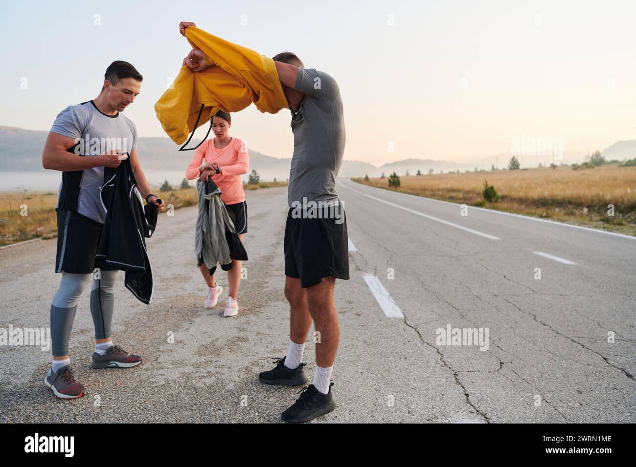 Morning Prep: Group of Athletes Getting Ready for a Run Stock Photo - Alamy