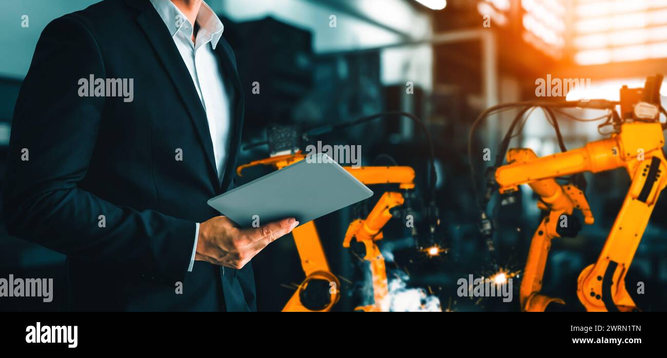 XAI Engineer use advanced robotic software to control industry robot ...