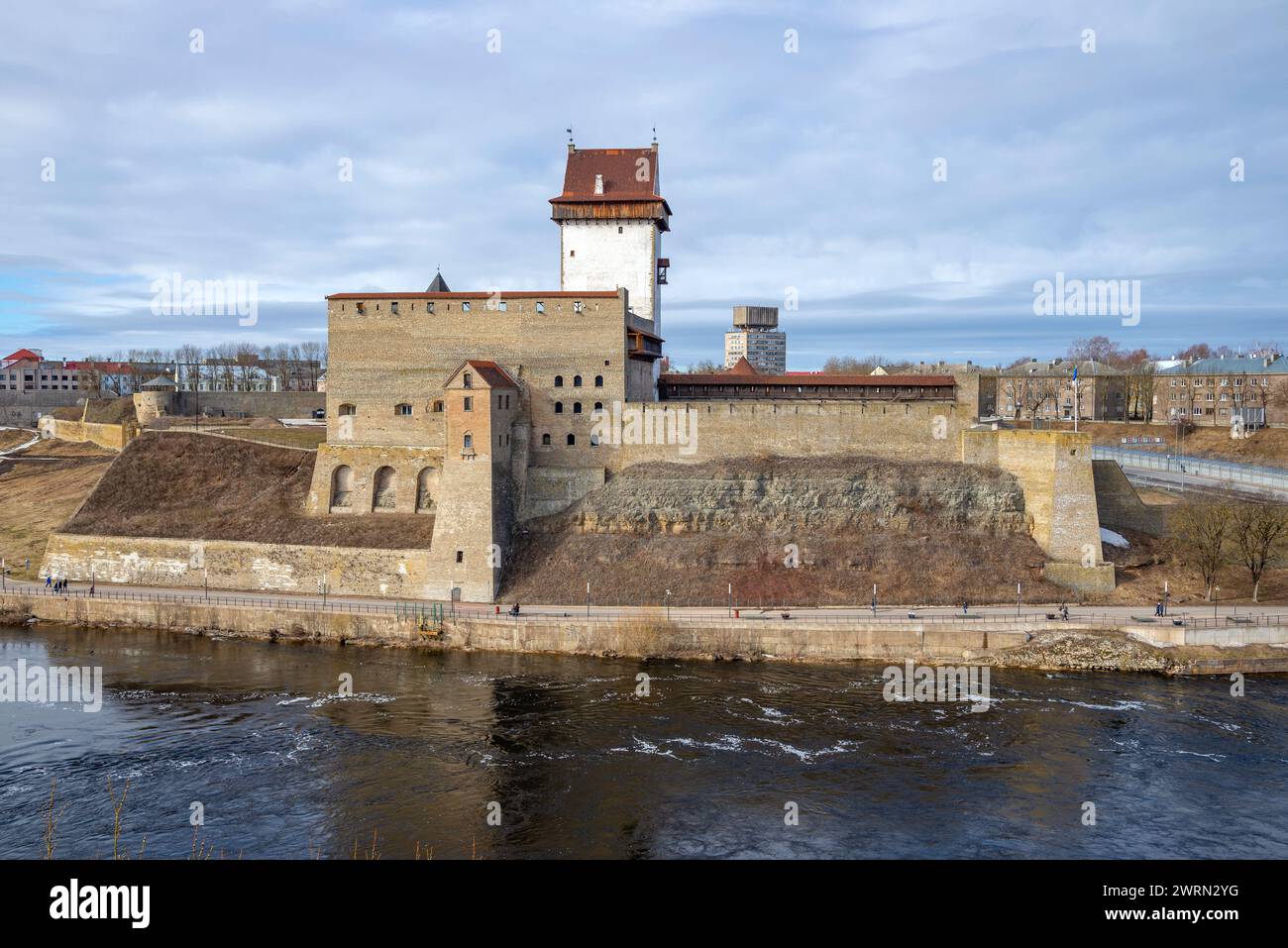 Herman's ancient castle on the river bank. Narva, Estonia Stock Photo ...