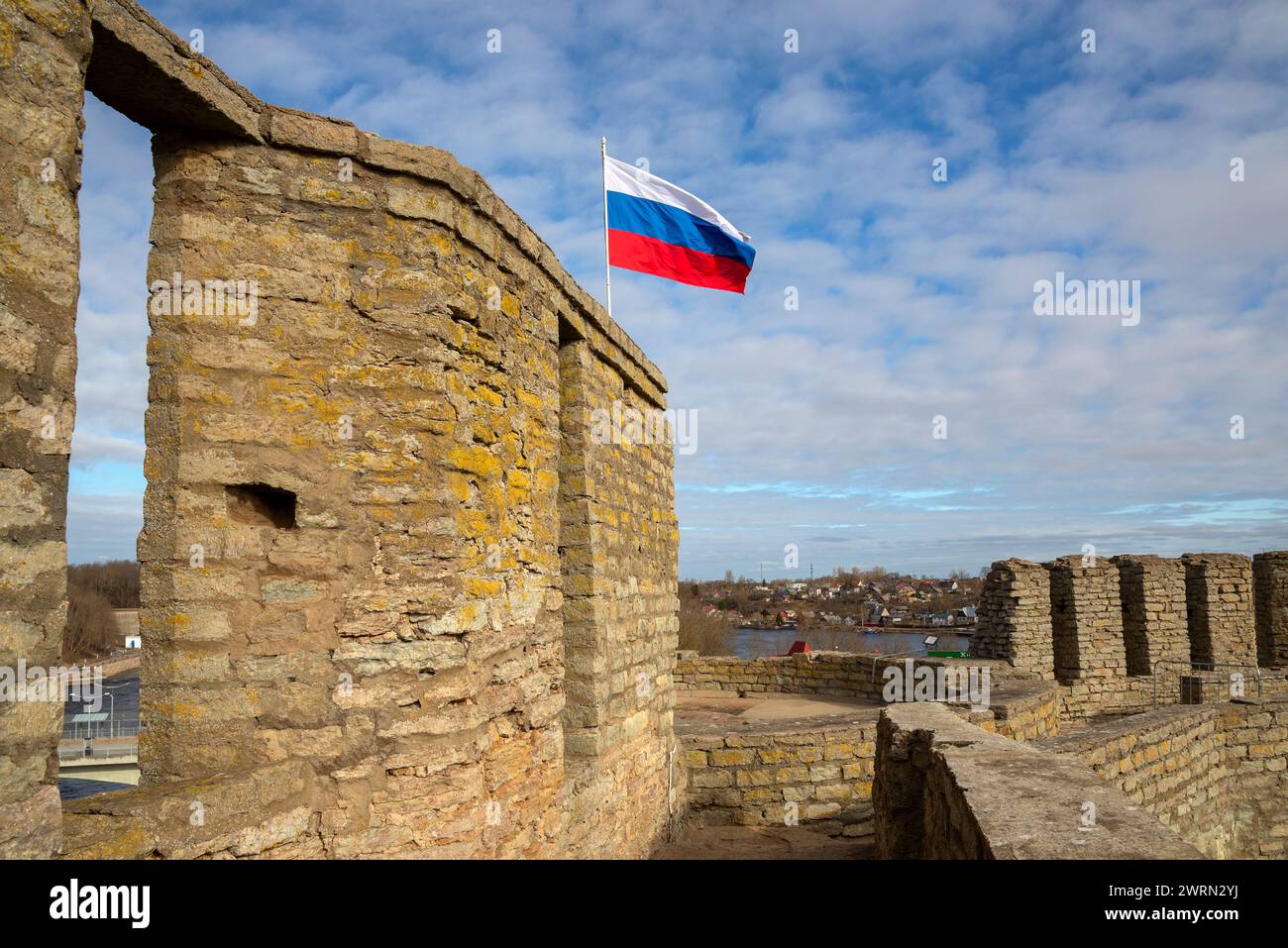 The flag of the Russian Federation on the wall of the old fortress ...