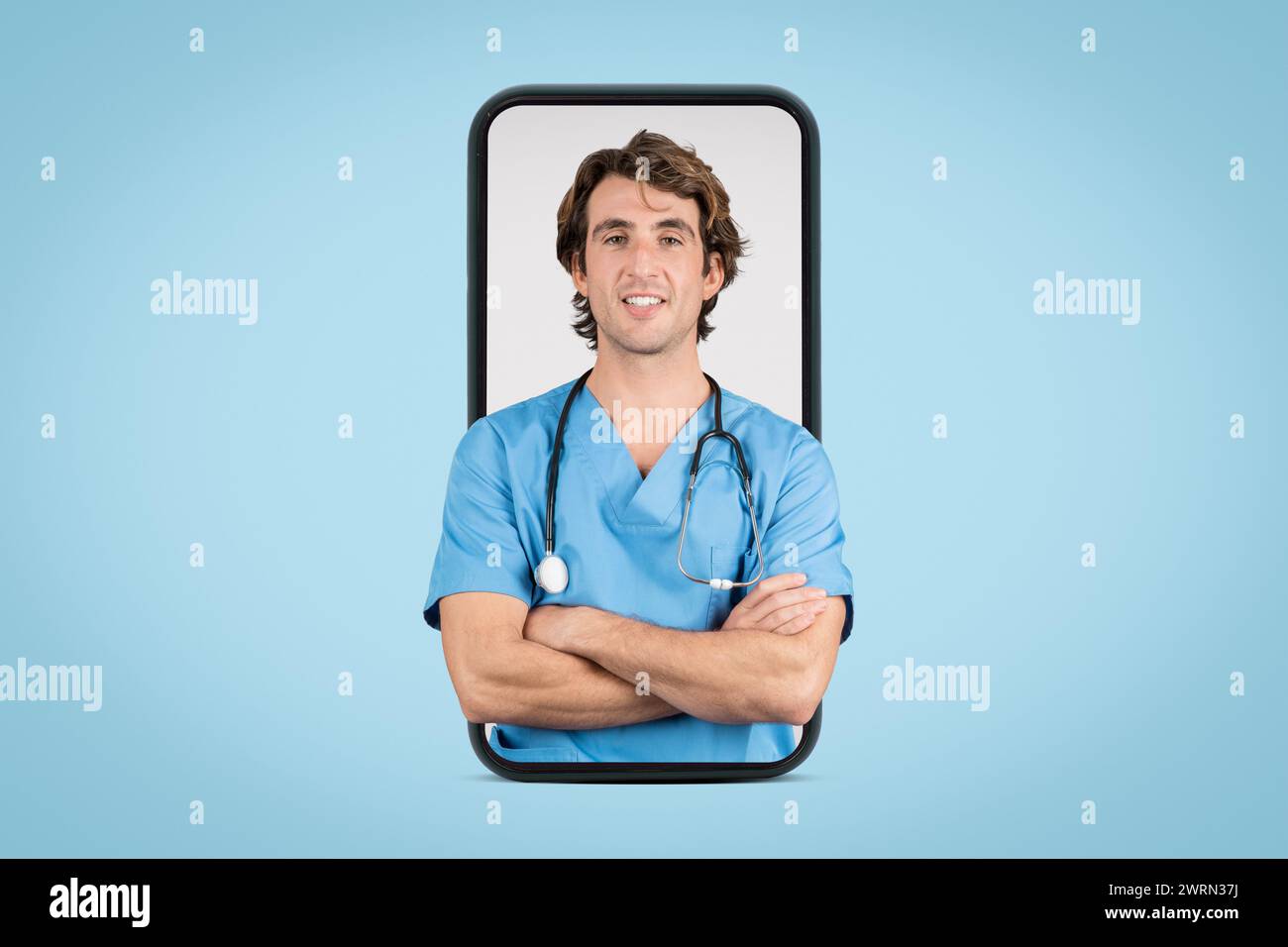 Smiling male nurse in blue scrubs inside smartphone frame with crossed ...