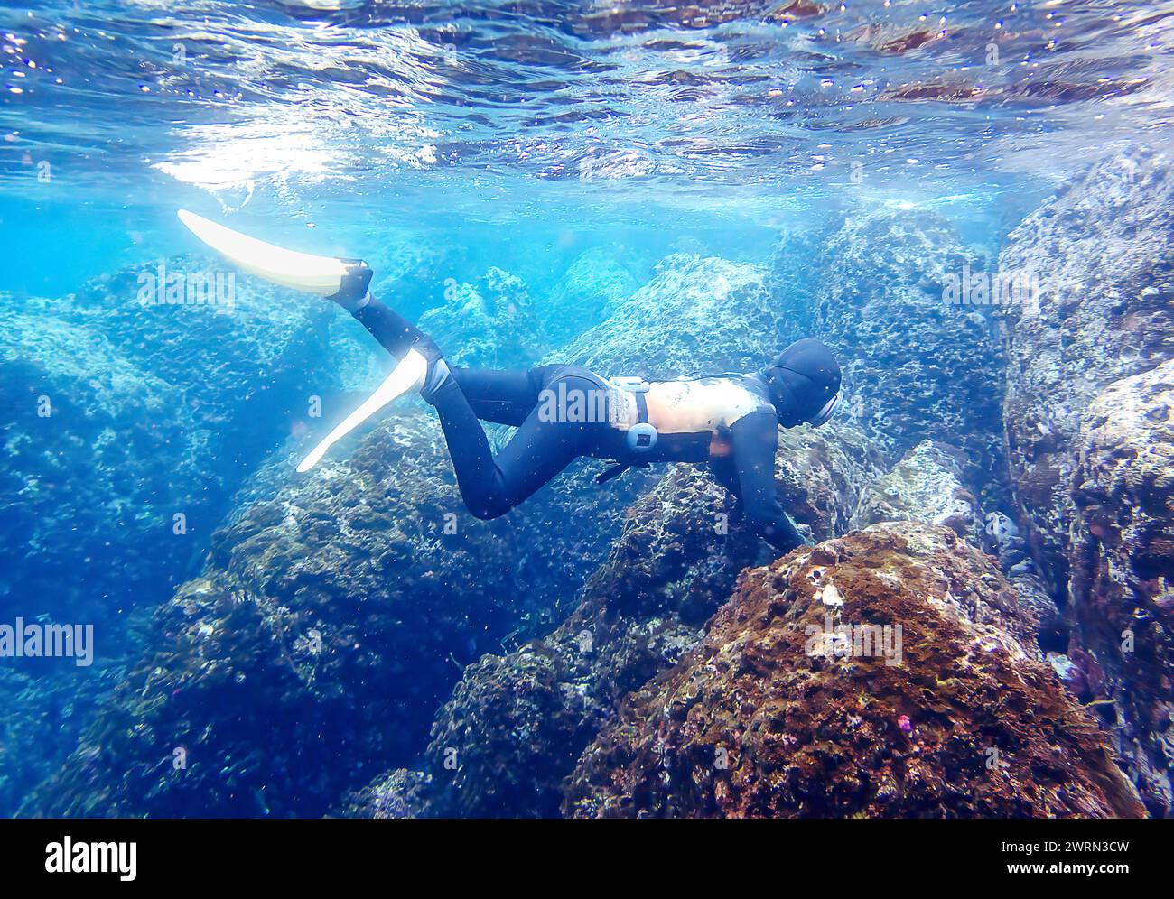 Woman holding breath underwater hi-res stock photography and images - Alamy