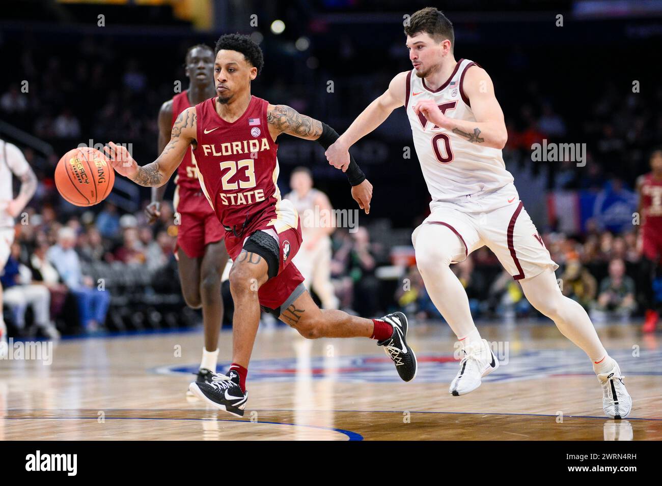 Florida State guard Primo Spears (23) and Virginia Tech guard Hunter ...