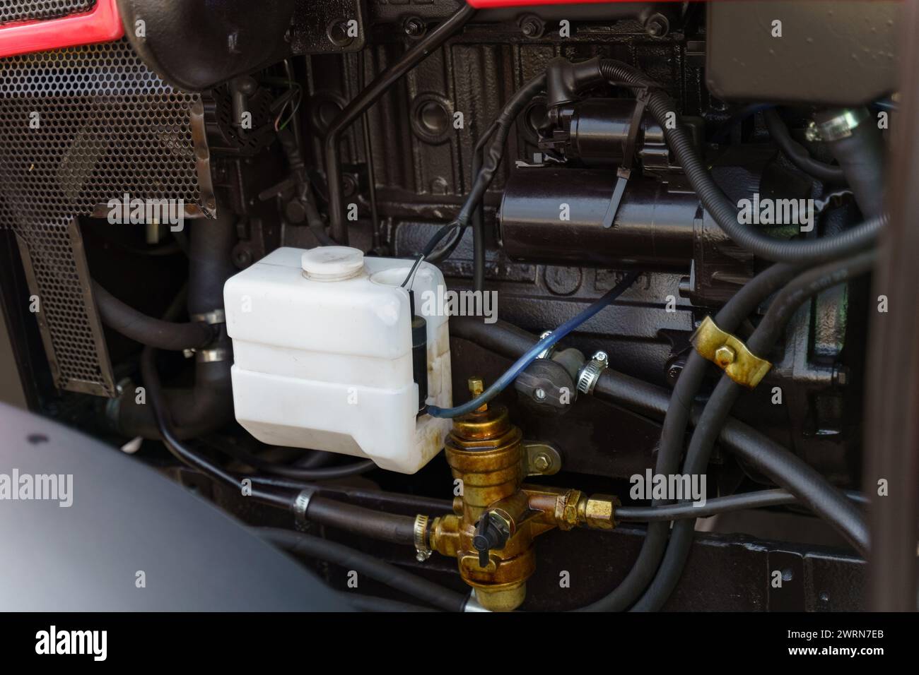 Detailed view of the engine compartment - white coolant reservoir ...