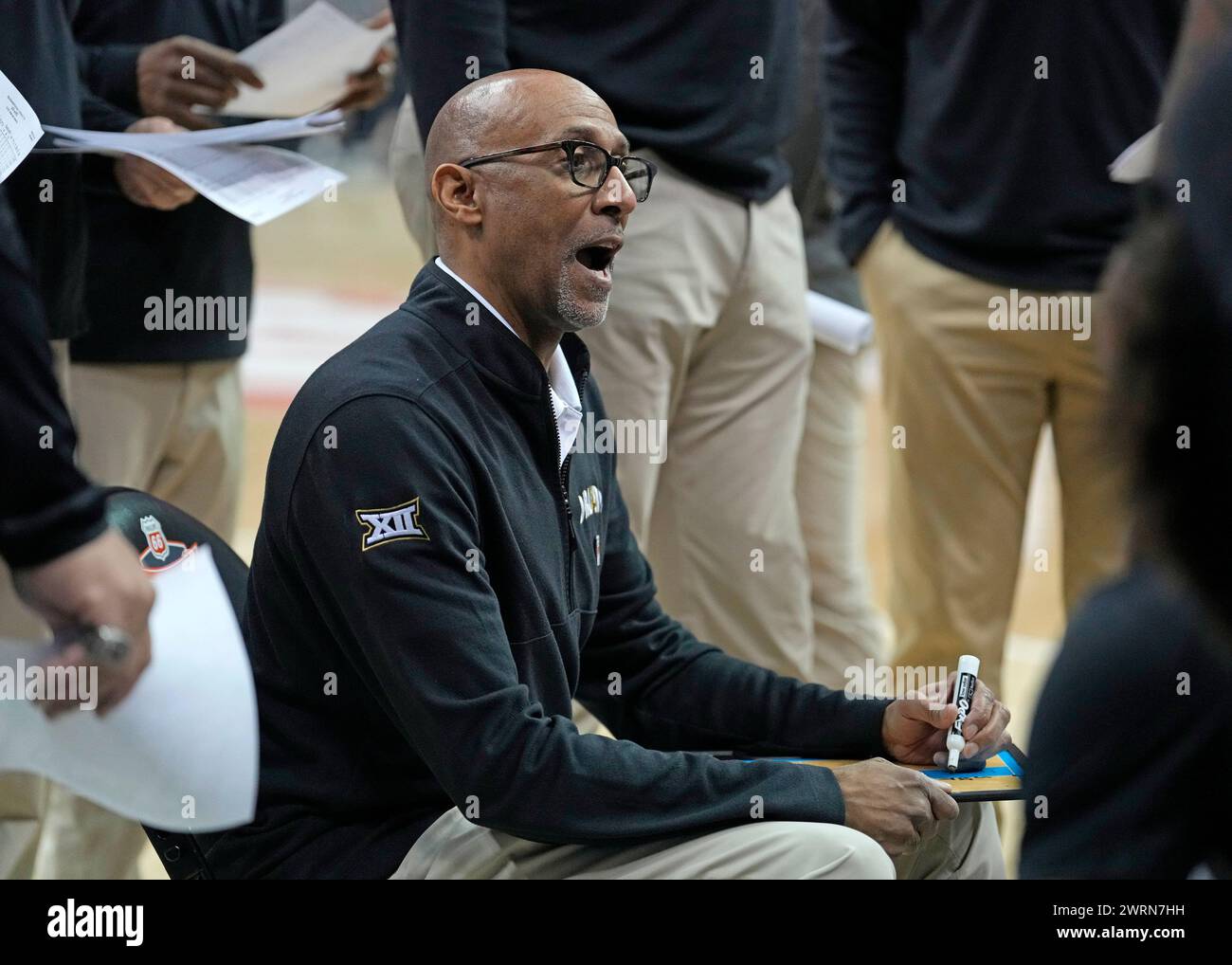MAR 13 2024: UCF coach Johnny Dawkins draws up a play during a time out ...