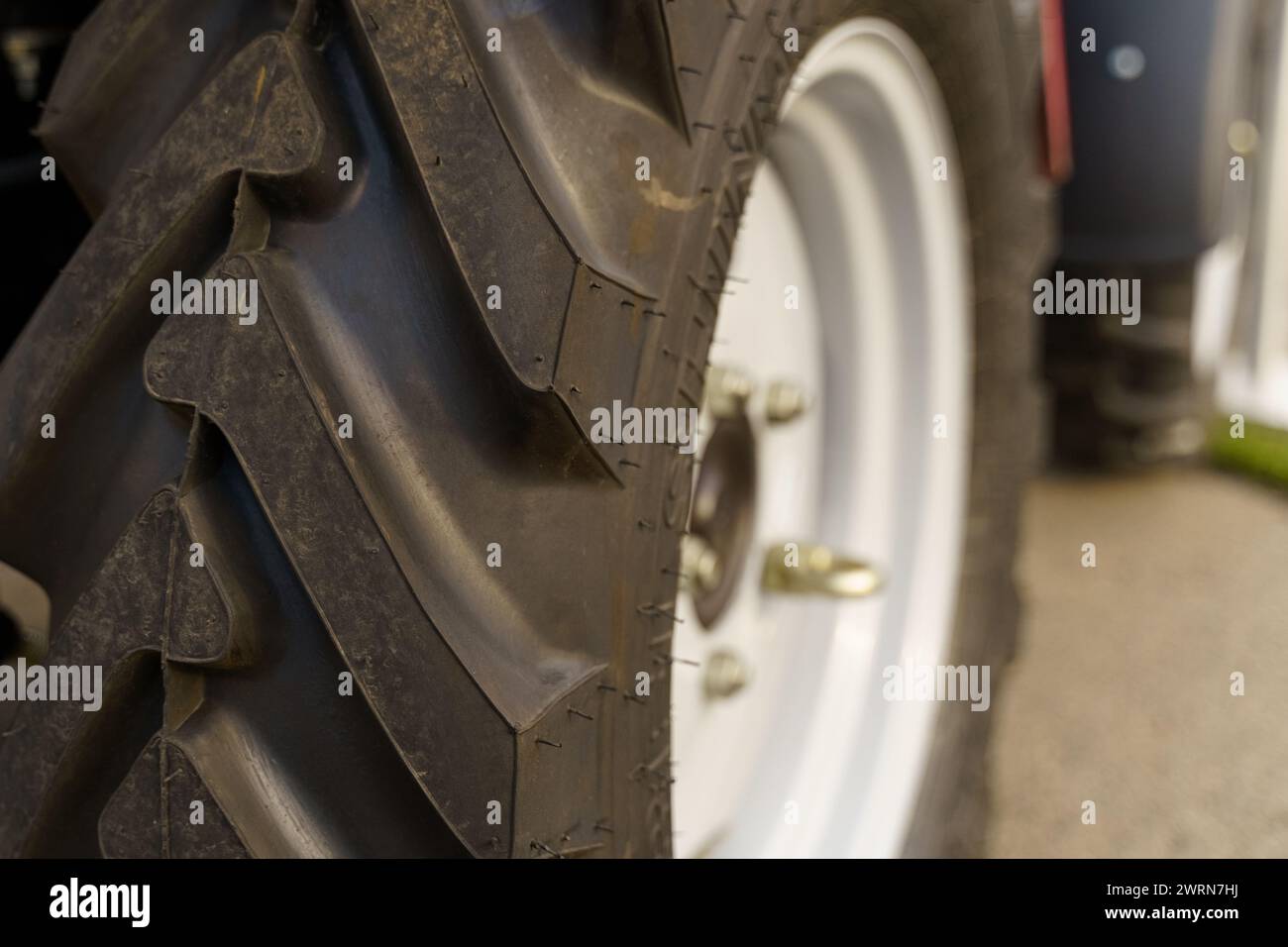 Detailed view showing the tread pattern and wear on a tire mounted on a ...