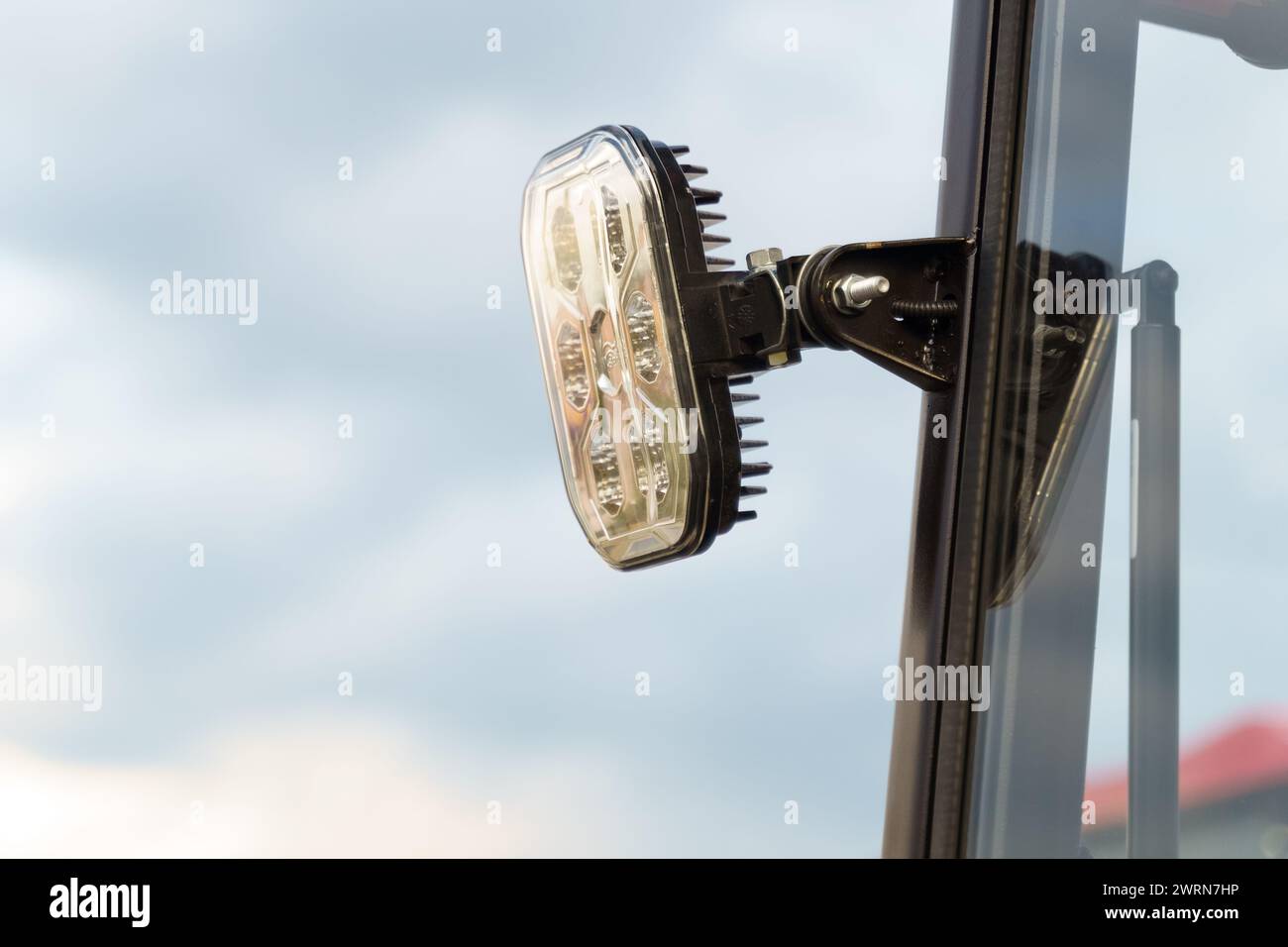 Close-up of the rear LED light on the cab of an agricultural tractor ...