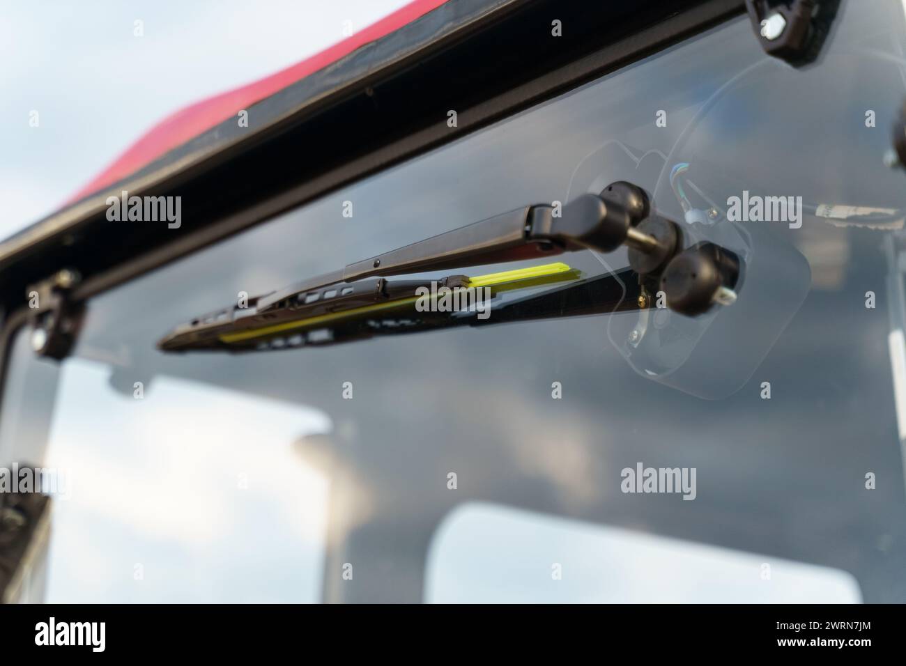 Detailed close-up of a tractor's rear view glass, showing the glass ...