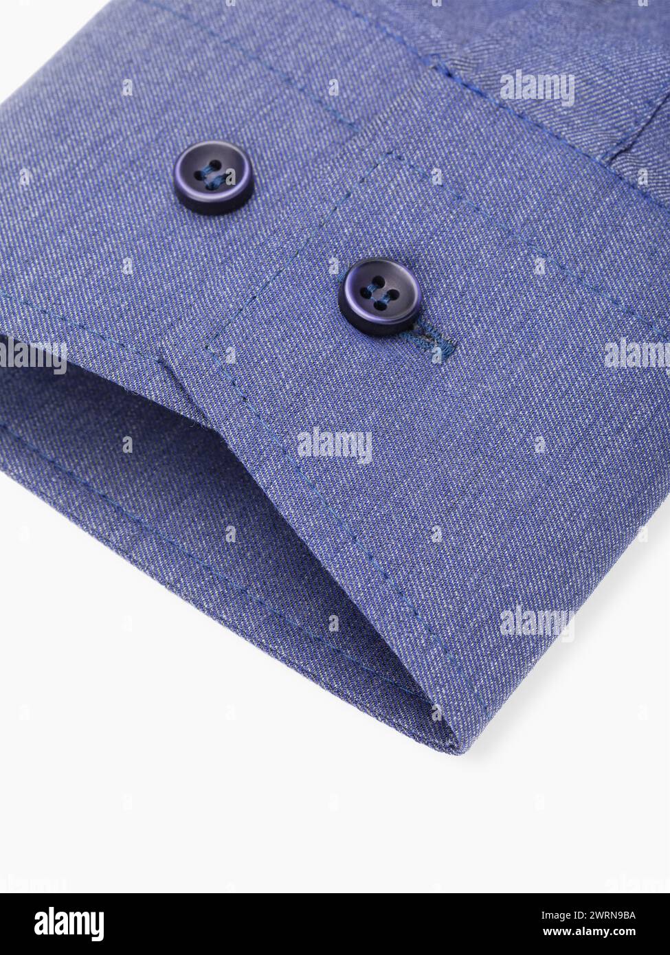Shirt cuff with buttons on a light background close-up Stock Photo - Alamy