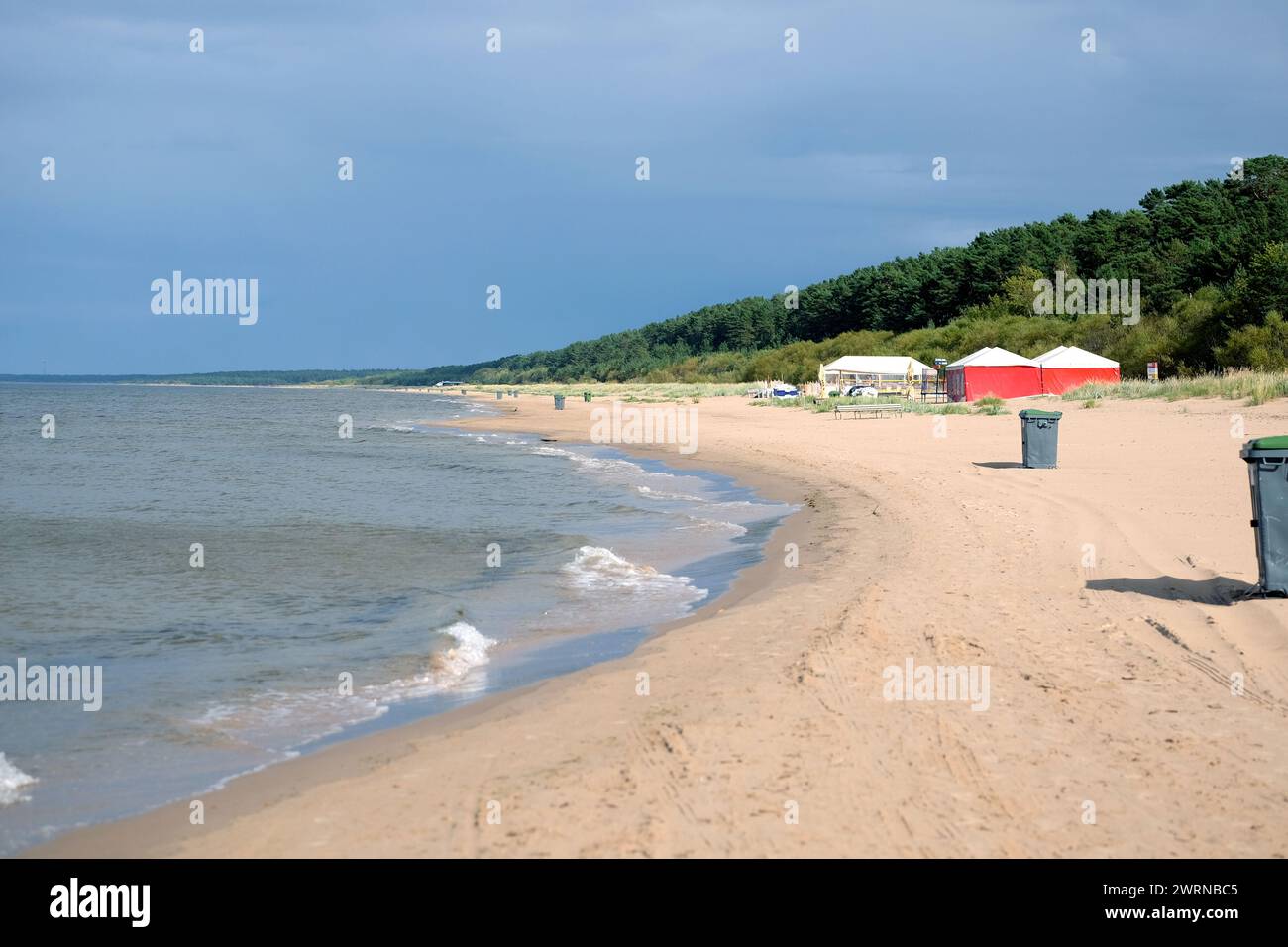 Empty long sandy beach on Baltic Sea in Riga suburban in Jurmala in overcast day in low season ...