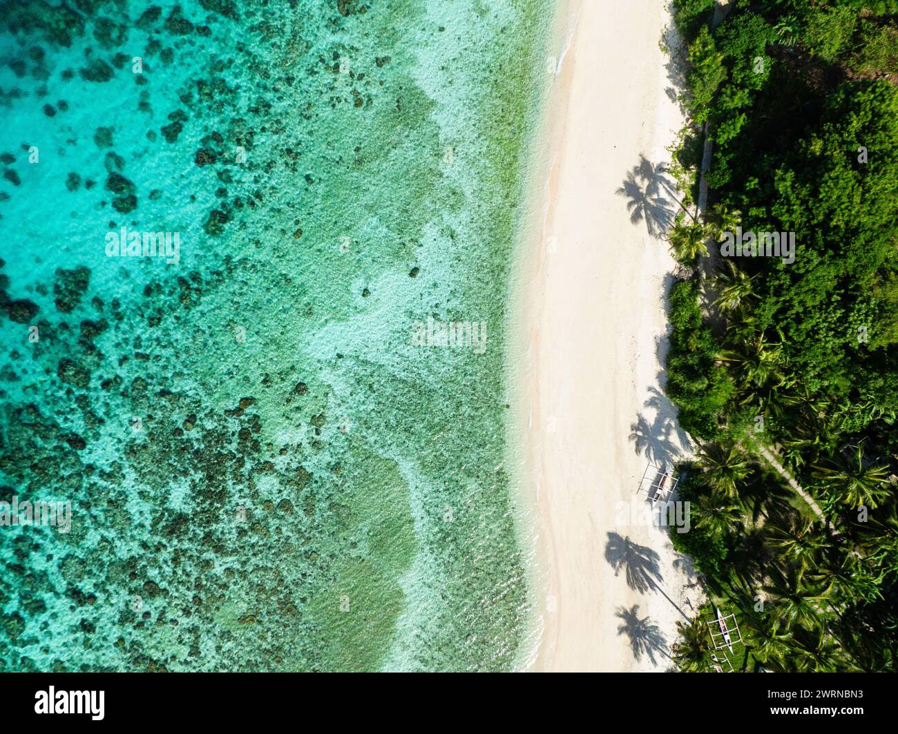 Ocean waves on sandy beach in Cobrador Island. Turquoise sea water in ...