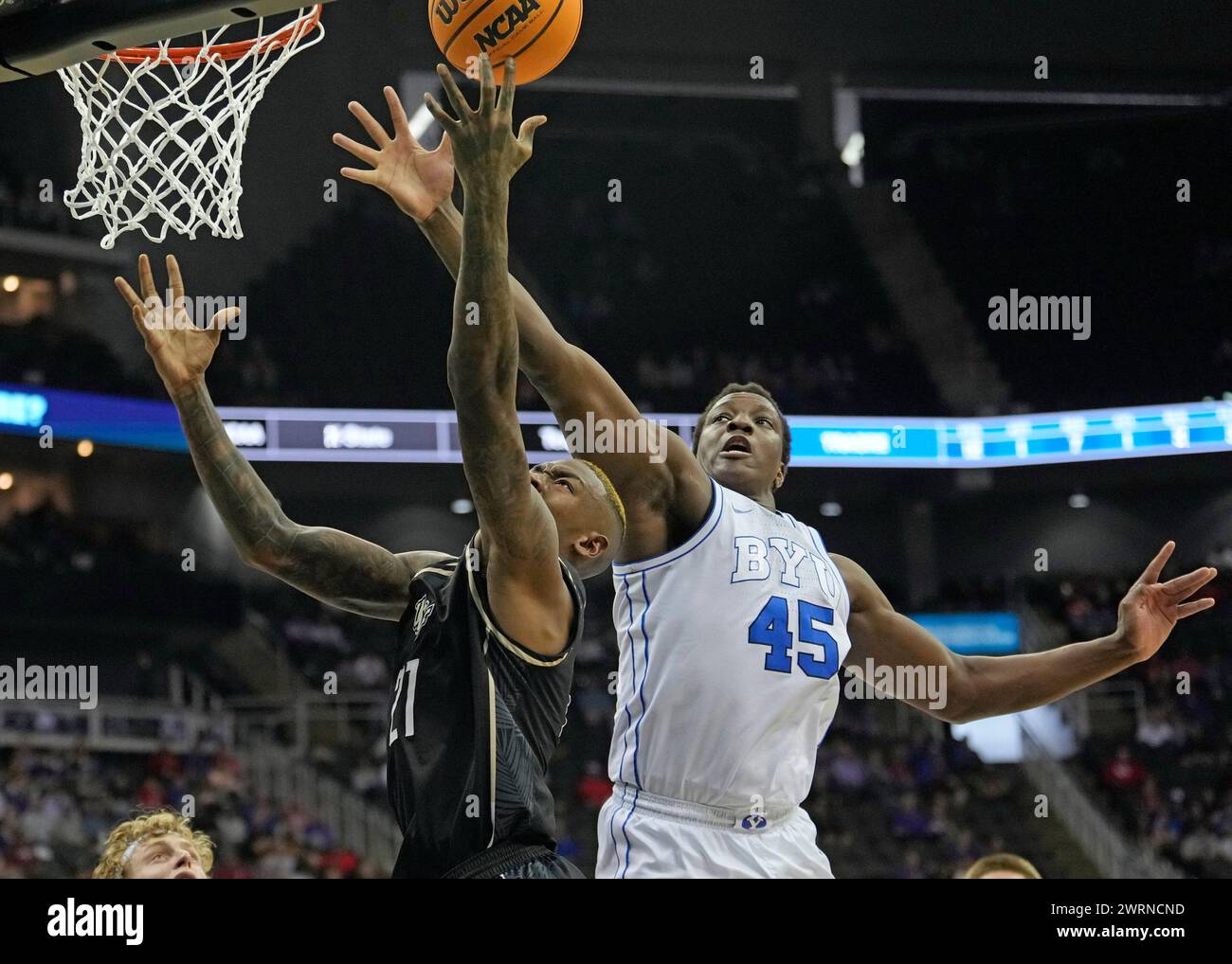 MAR 13 2024: UCF Knights forward C.J. Walker (21) scores against Brigham Young Cougars forward ...