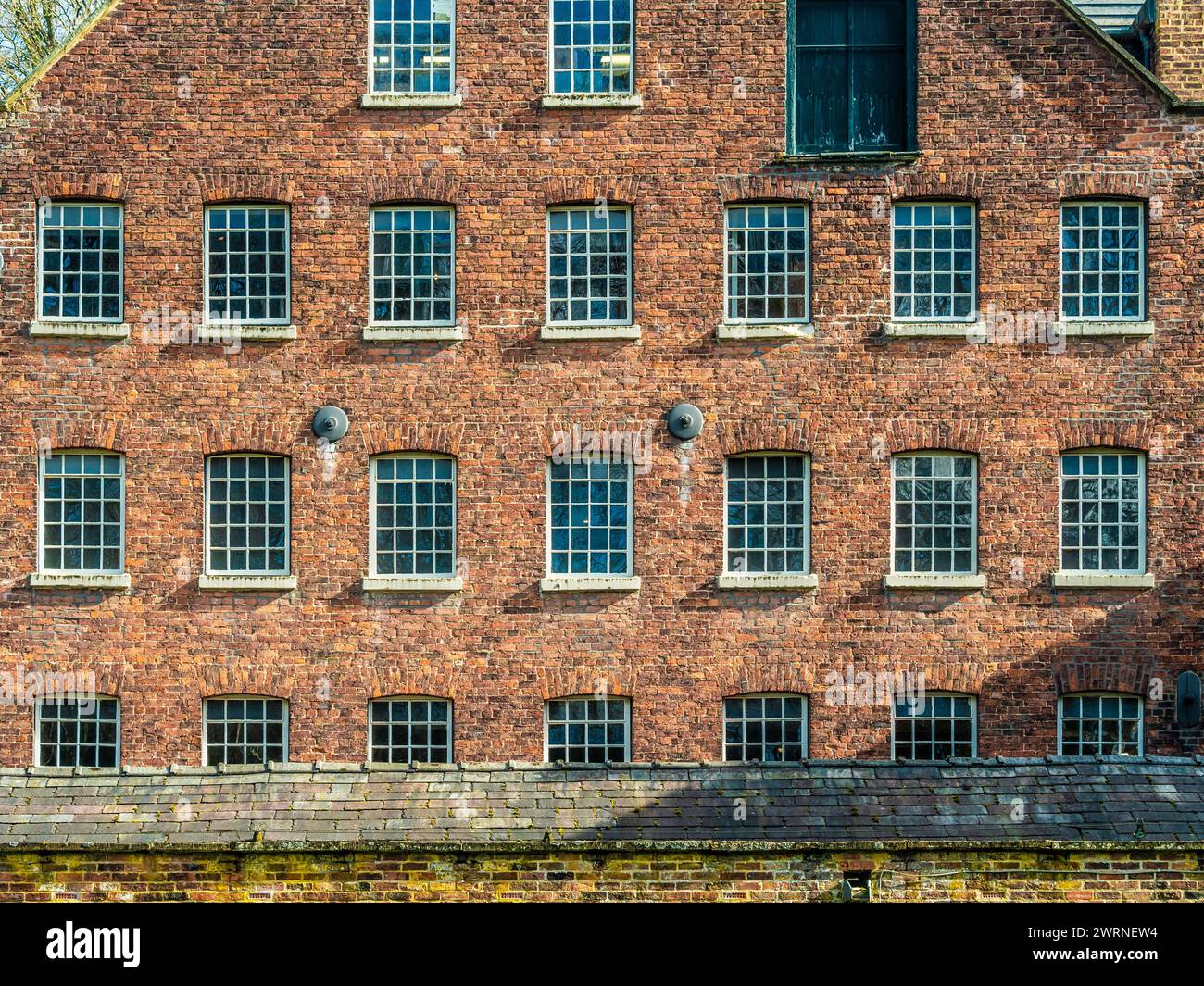 Exterior facade of Quarry Bank Mill in Styal, Cheshire, UK Stock Photo ...