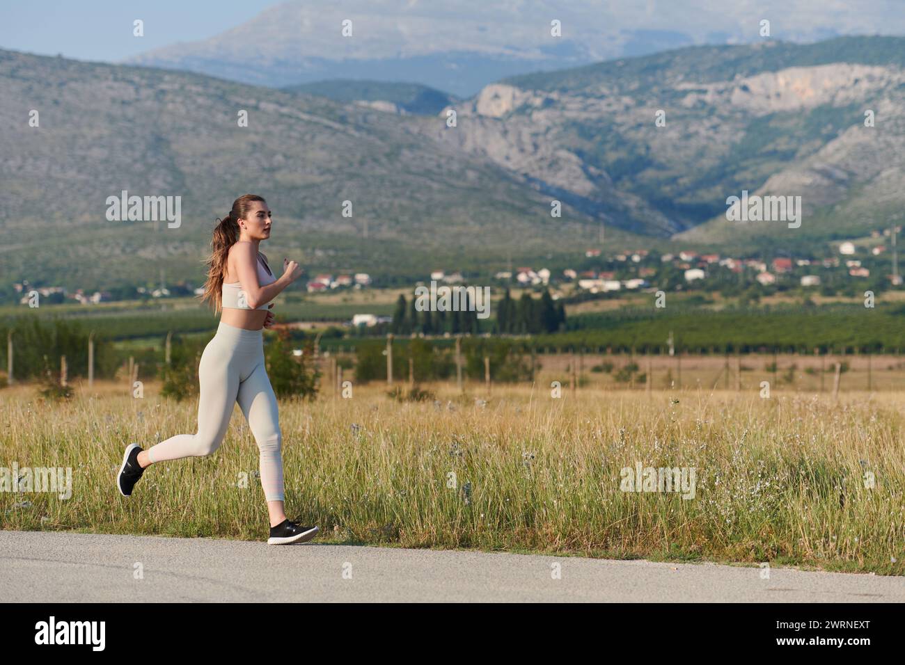 Solo Stride: Determined Athlete Woman Embarks on Fitness Journey for Marathon Preparation Stock ...