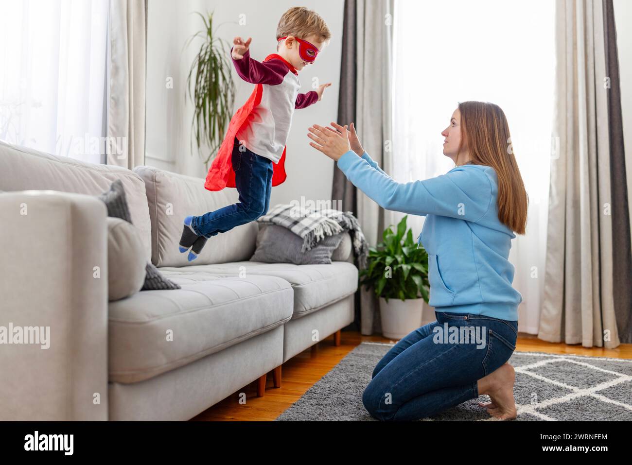 Mother and Child Playful Living Room Fun Stock Photo - Alamy