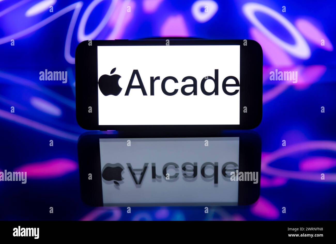 In this photo illustration, an Apple Arcade logo is seen displayed on a ...