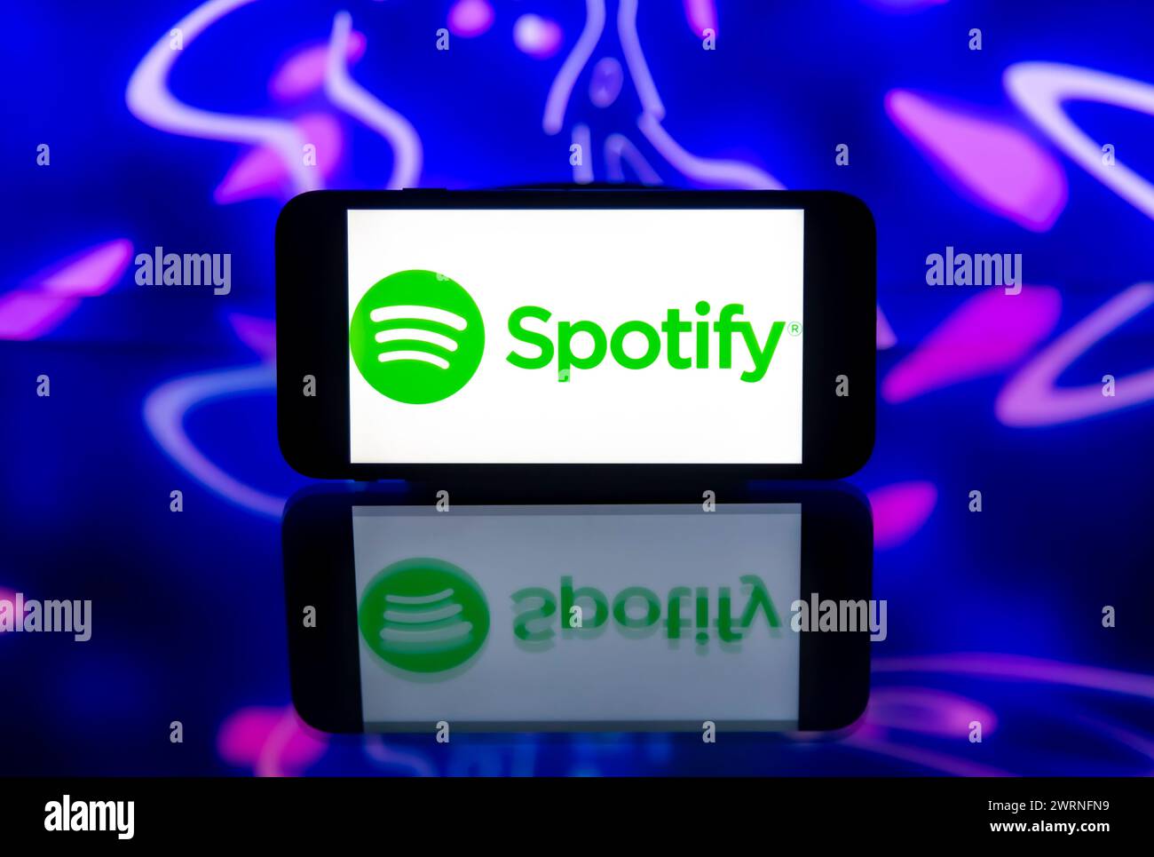 In this photo illustration, the Spotify logo is seen displayed on a ...