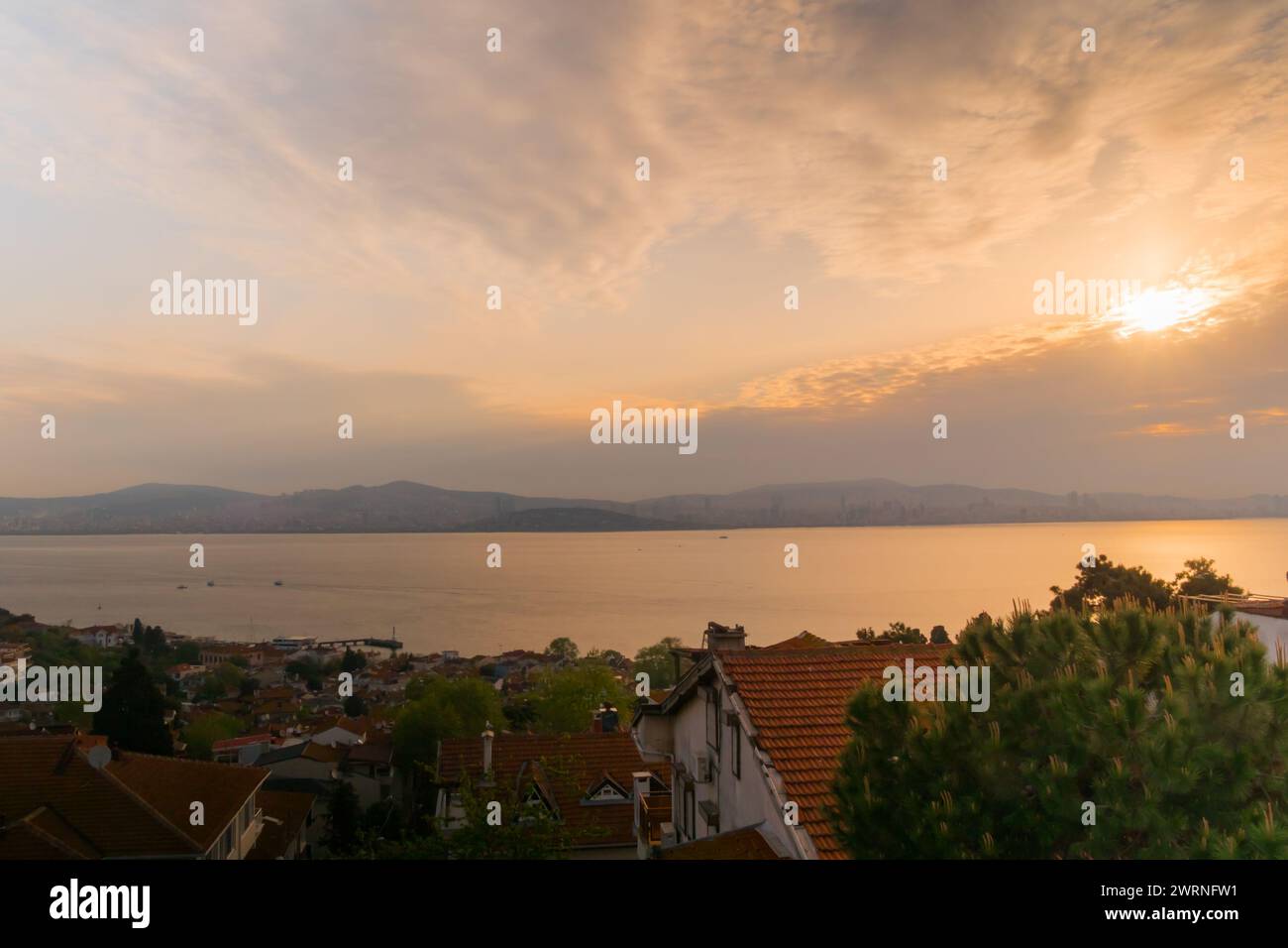 View of dramatic cloudy sunrise sky with the rising sun over Istanbul ...