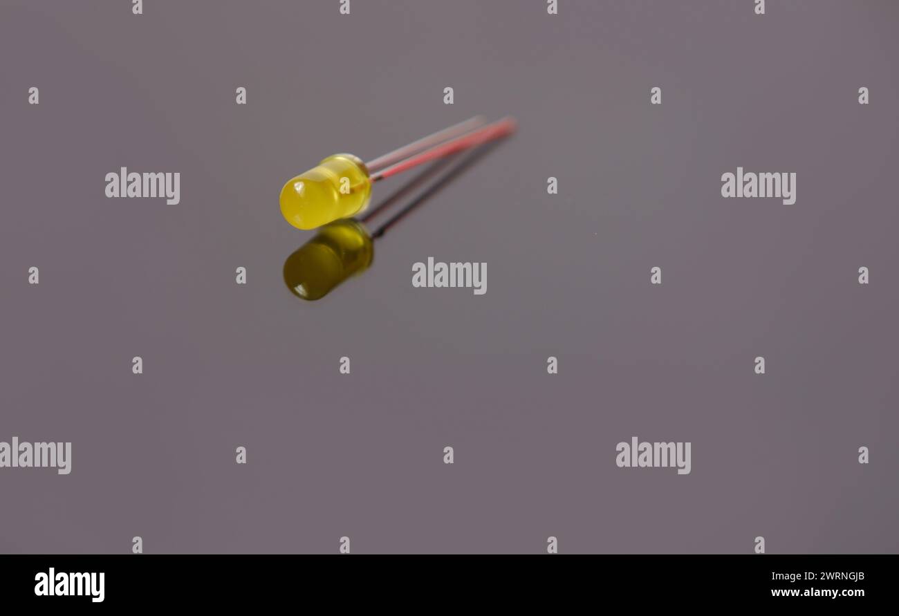 Isolated single yellow Light Emitting Diode (LED) on the gray Stock Photo - Alamy