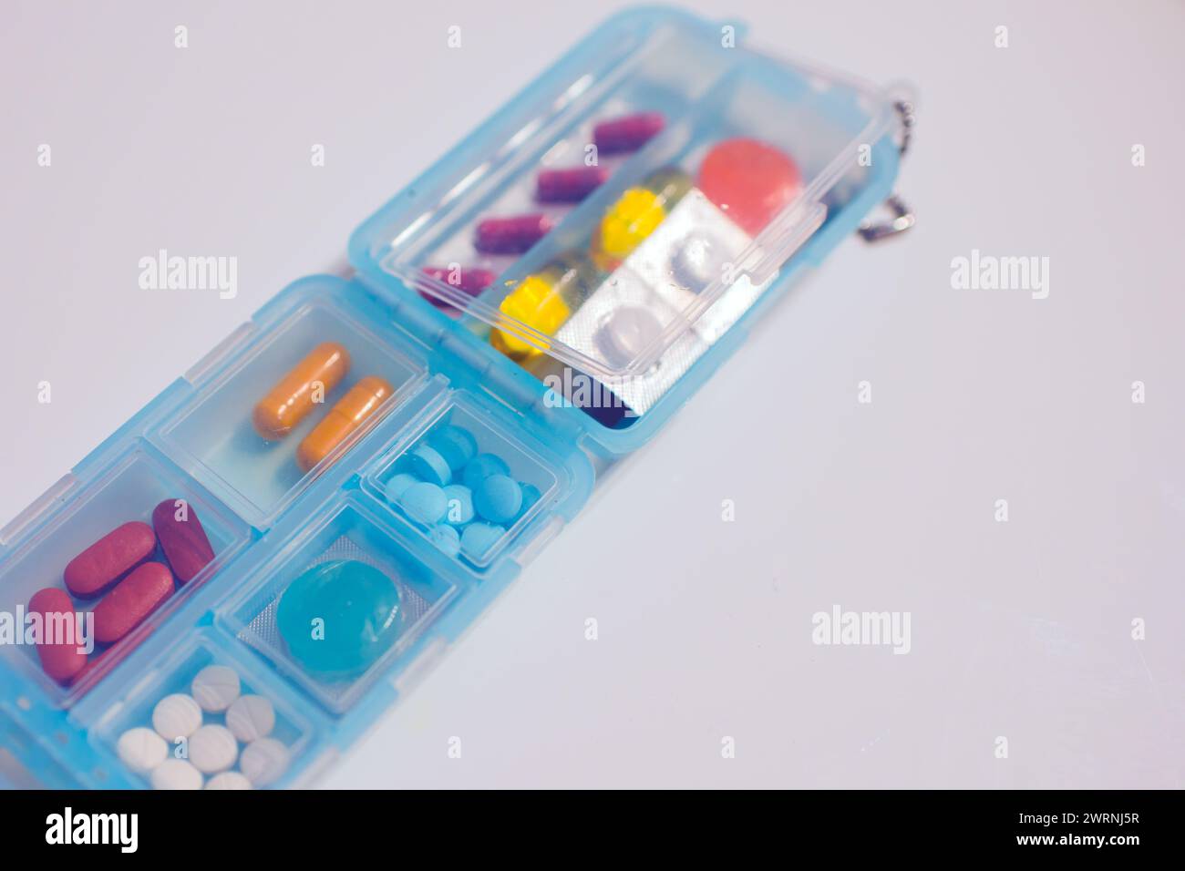 First aid travel box with pills. White background Stock Photo - Alamy