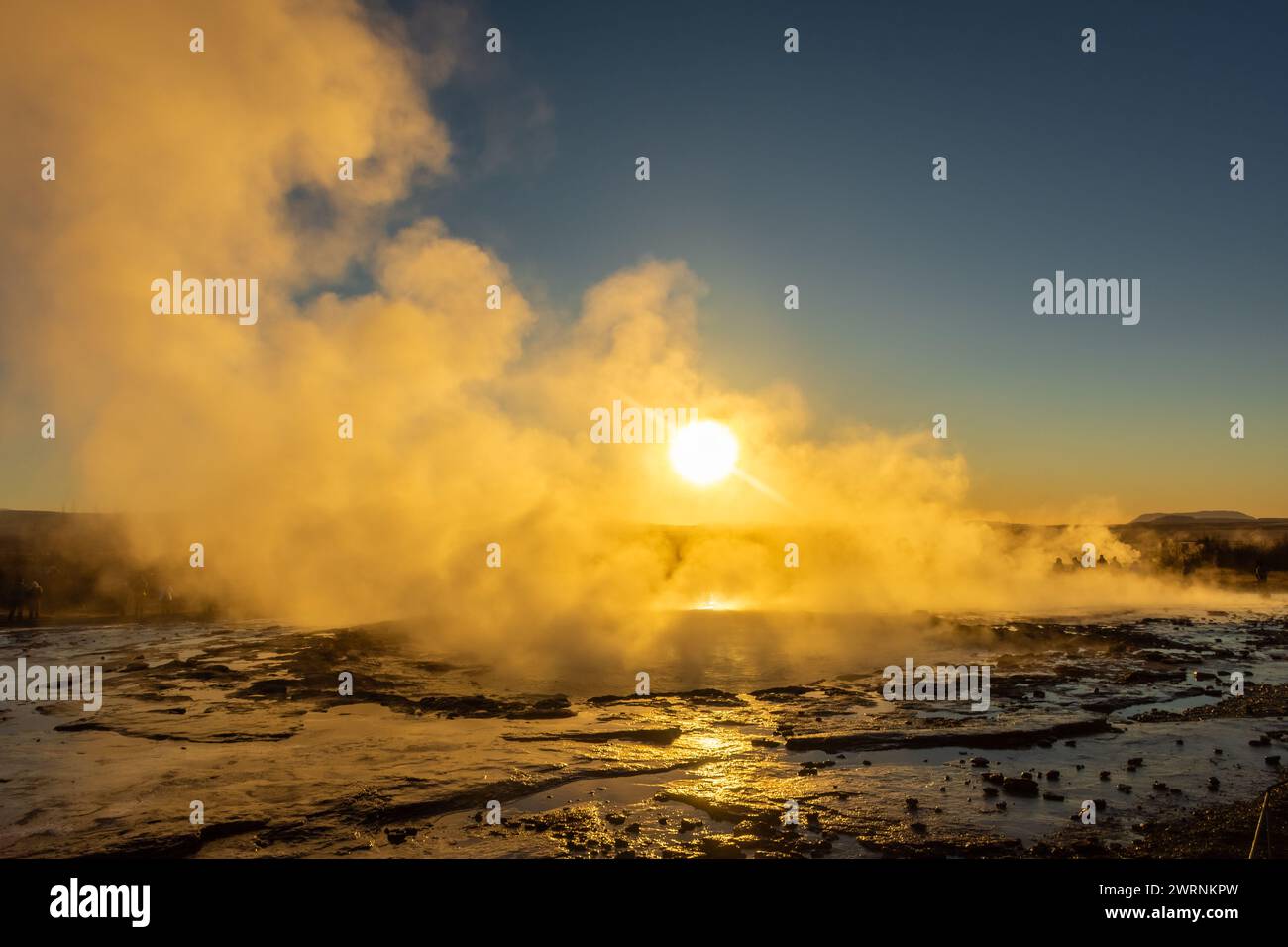 Stokkur geyser spectacular eruption in front of the sun, Iceland Stock ...