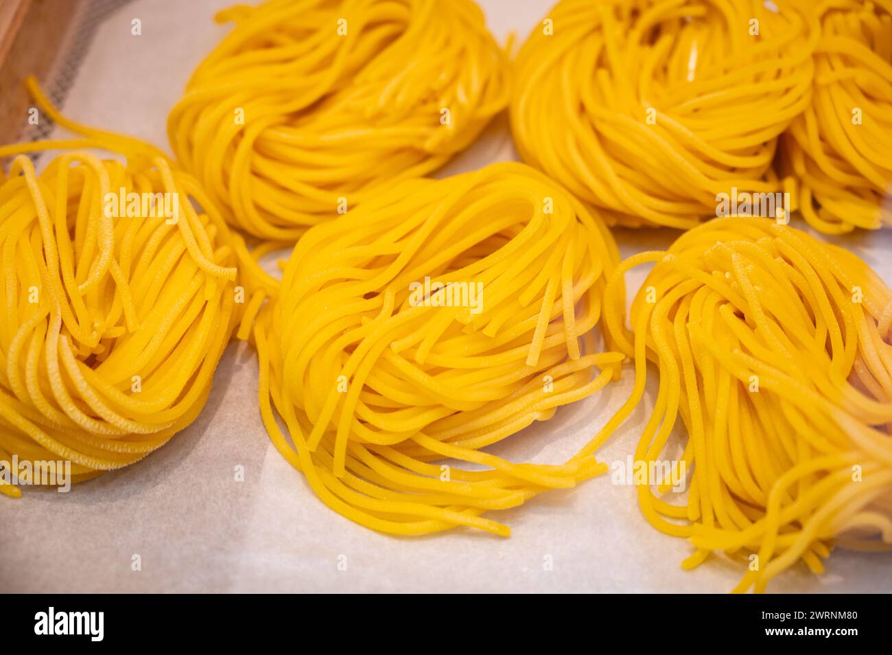 Italian food, fresh homemade yellow pasta with eggs ready to cook on ...