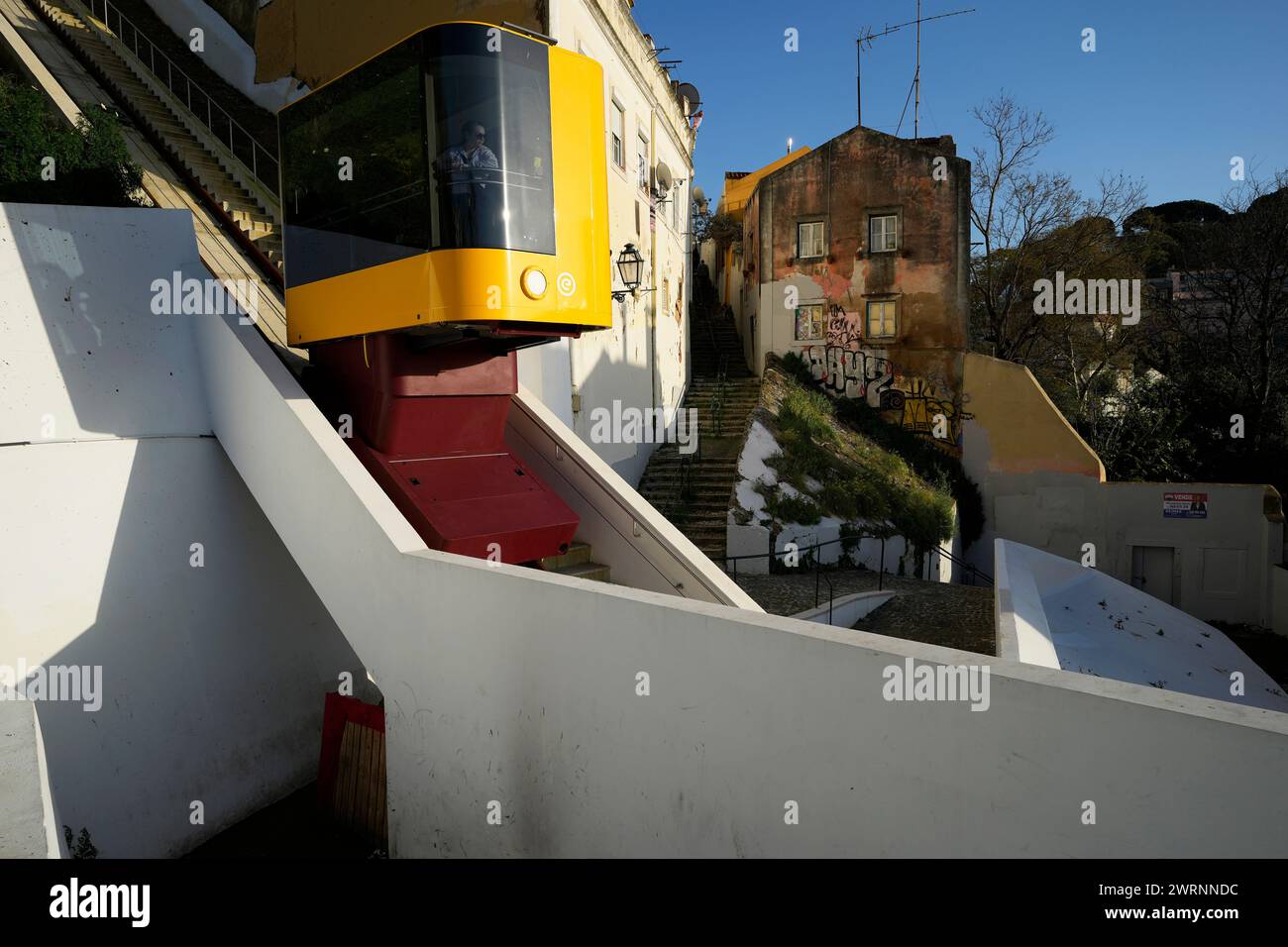 A passenger looks out from the just inaugurated funicular that connects ...