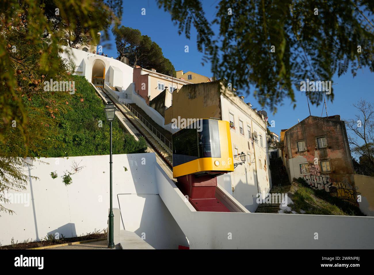 A passenger looks out from the just inaugurated funicular that connects ...
