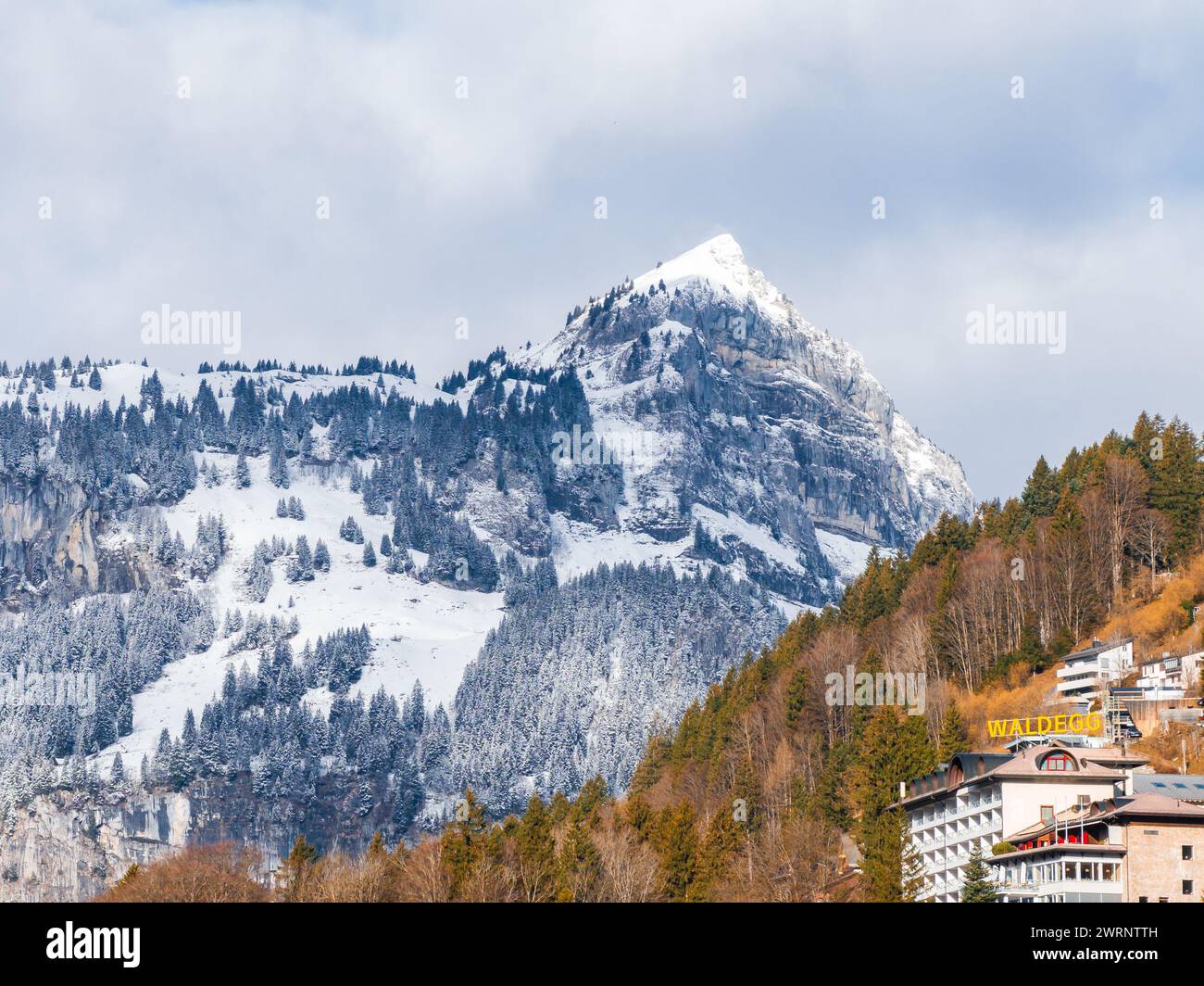 Winter Wonderland in Engelberg with WALDEGG Hotel and Snowy Peaks Stock ...