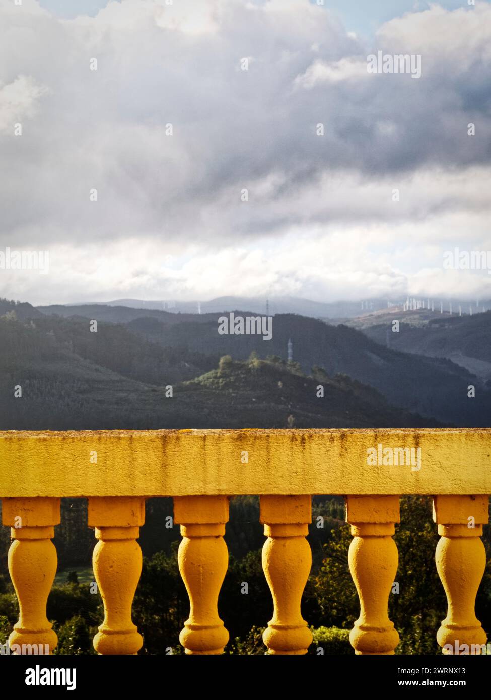A balcony overlooking mountains and clouds in the distance Stock Photo ...